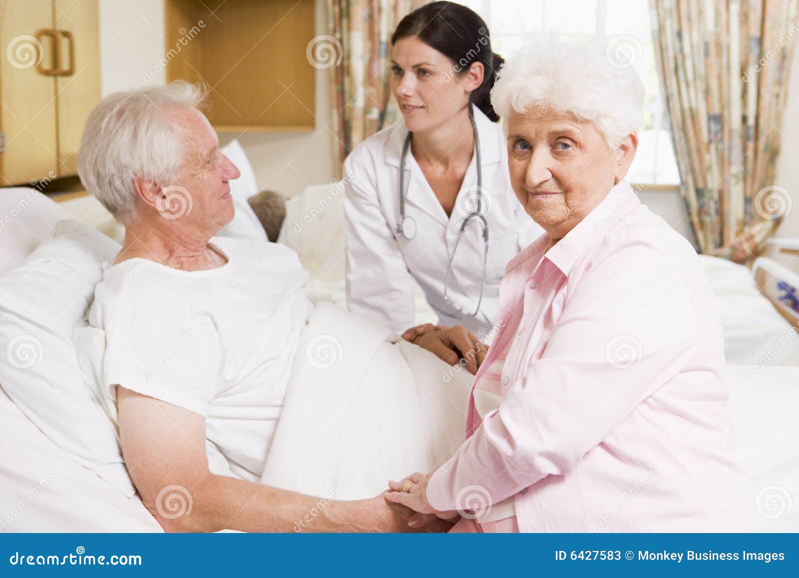 Doctor Talking To Senior Couple Stock Image - Image of female, sitting ...
