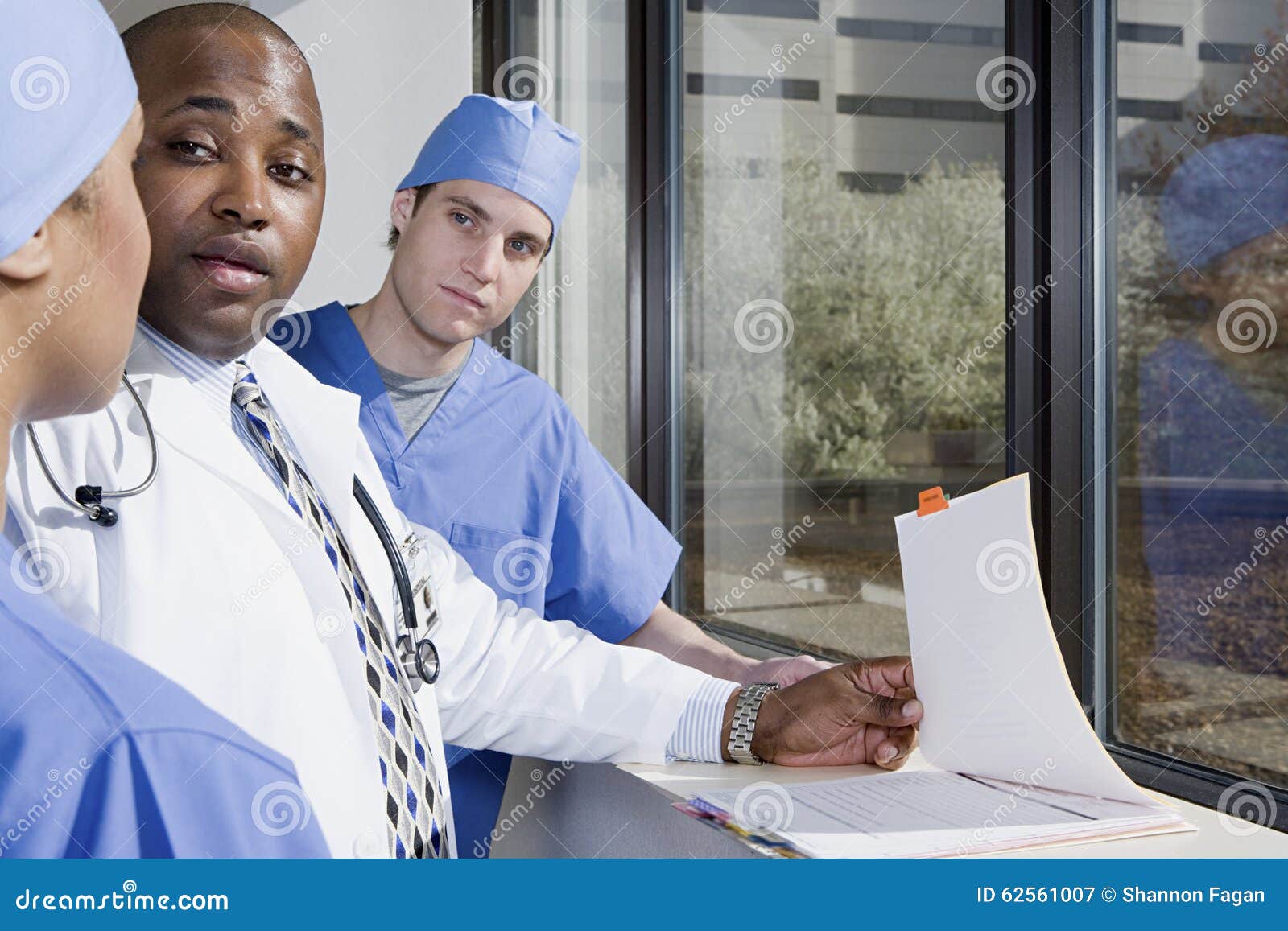 Doctor talking to surgeons stock image. Image of communication - 62561007