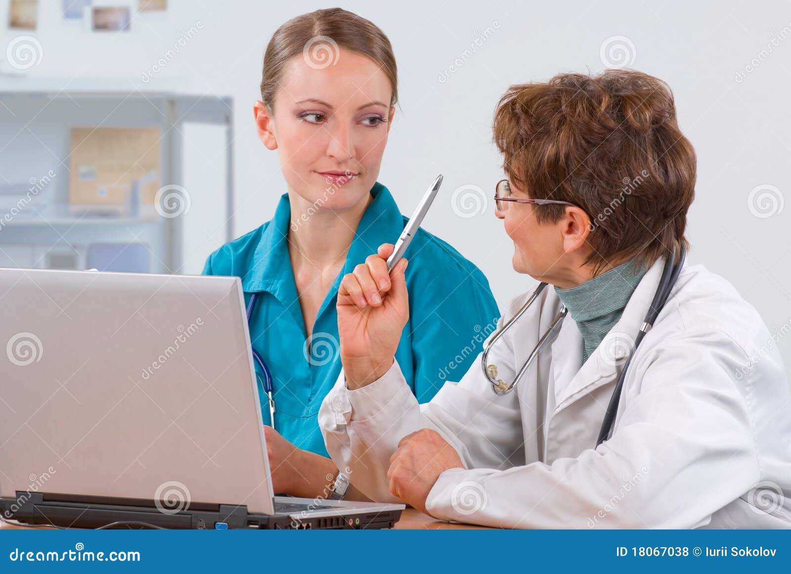 A doctor teaches a student stock photo. Image of occupation - 18067038