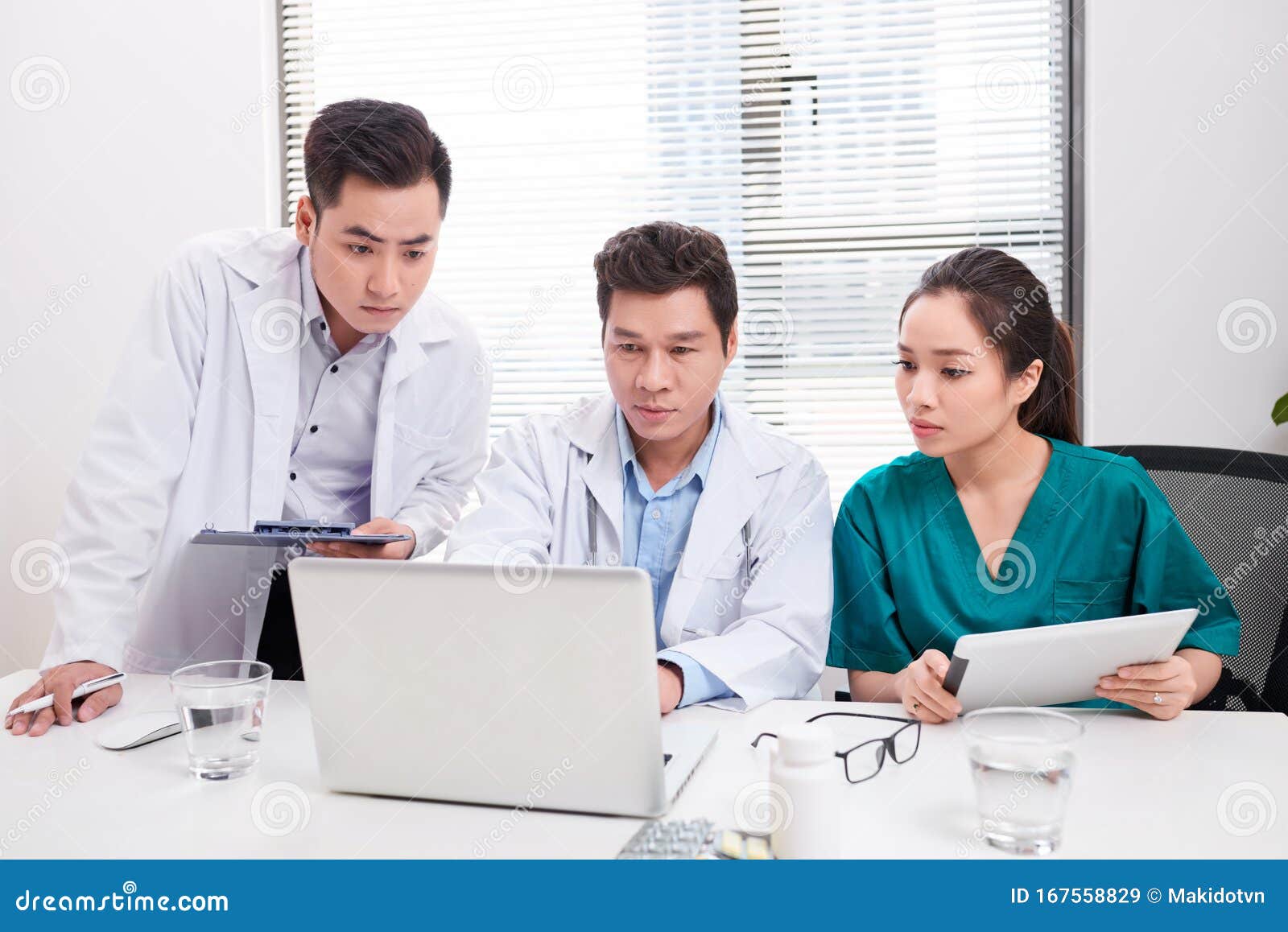 Doctor Team Working at Computer Desk in Hospital Stock Image - Image of ...