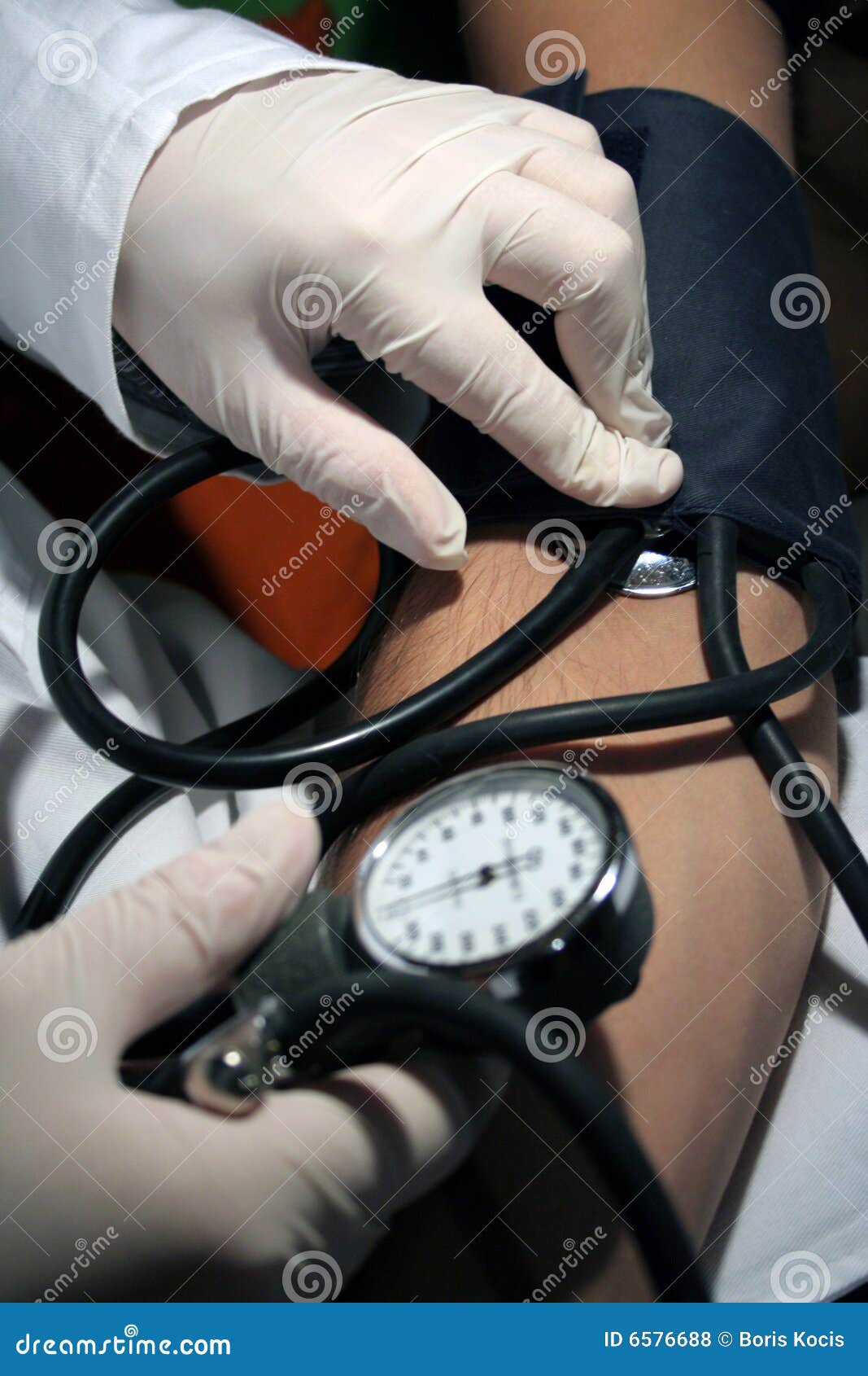 Doctor Testing Blood Pressure Stock Photo - Image of coat, hold: 6576688