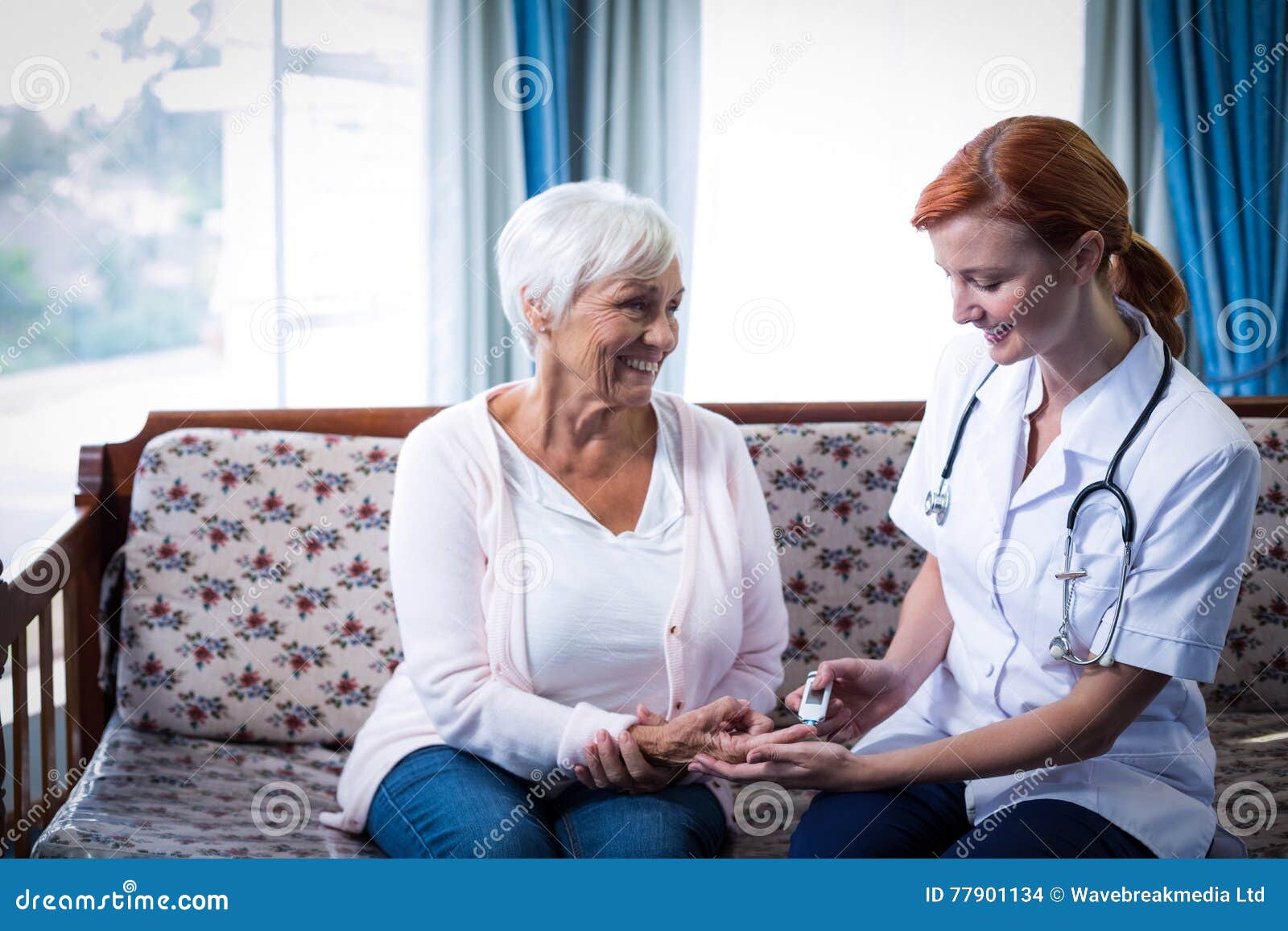 Doctor Testing a Patients Glucose Level Using a Digital Glucometer ...