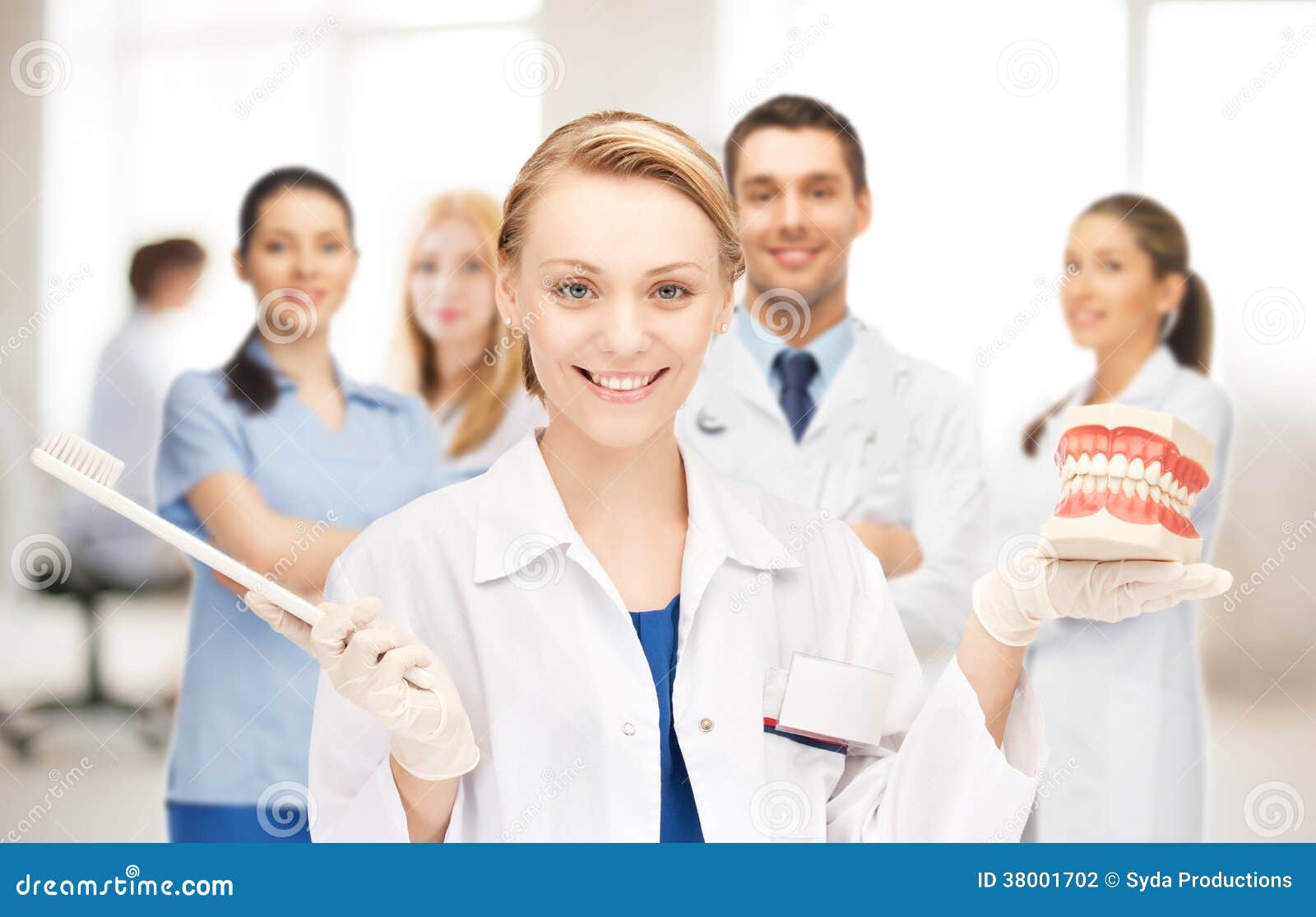 Doctor with Toothbrush and Jaws Stock Photo - Image of female, medical ...
