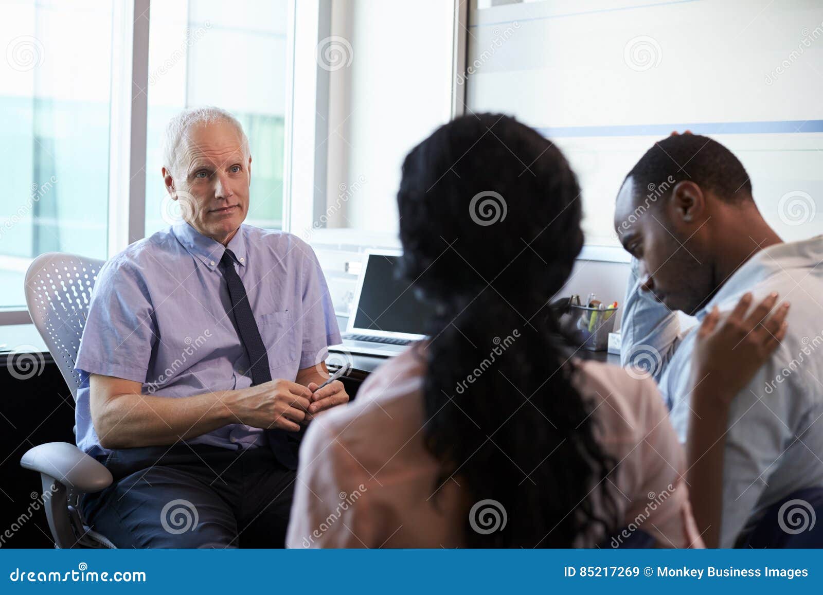 Doctor Treating Couple Suffering with Depression in Office Stock Image ...