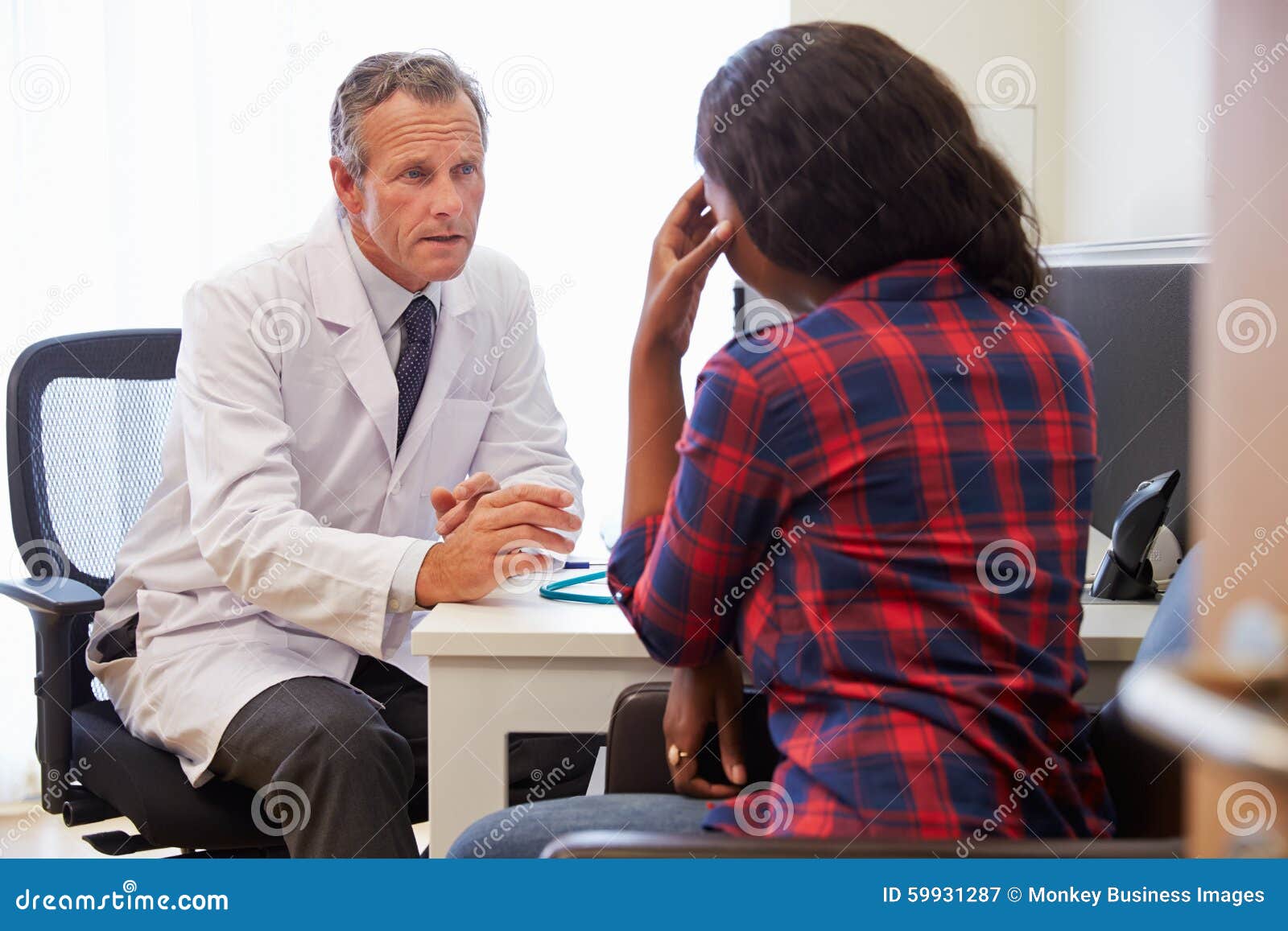 Doctor Treating Female Patient Suffering with Depression Stock Image ...