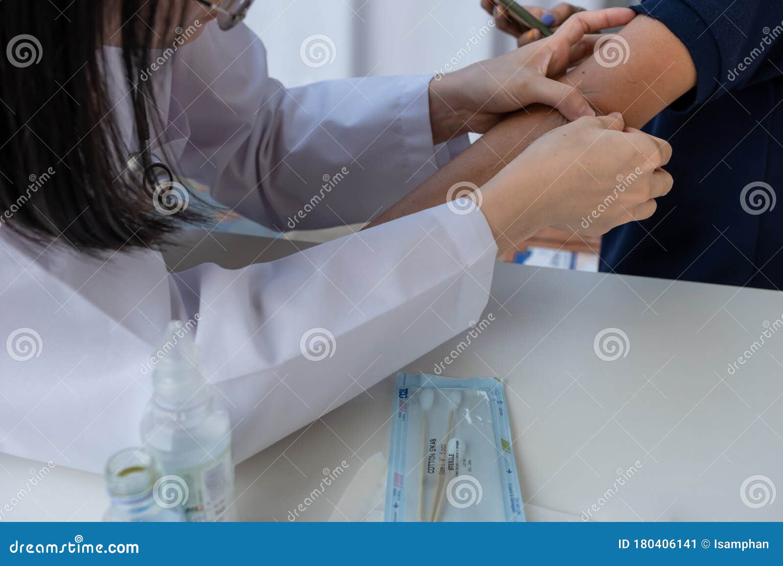 The Doctor is Treating the Wound on the Elbow of the Patient Stock ...