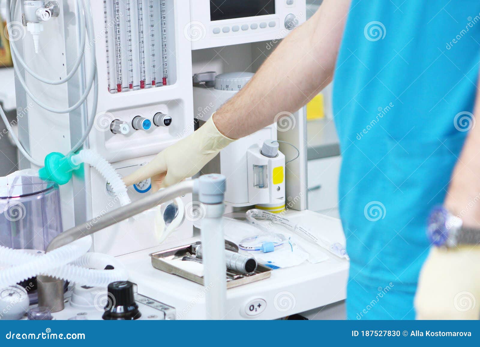 The Anesthesiologist Turns On The Machine For Artificial Ventilation Of ...