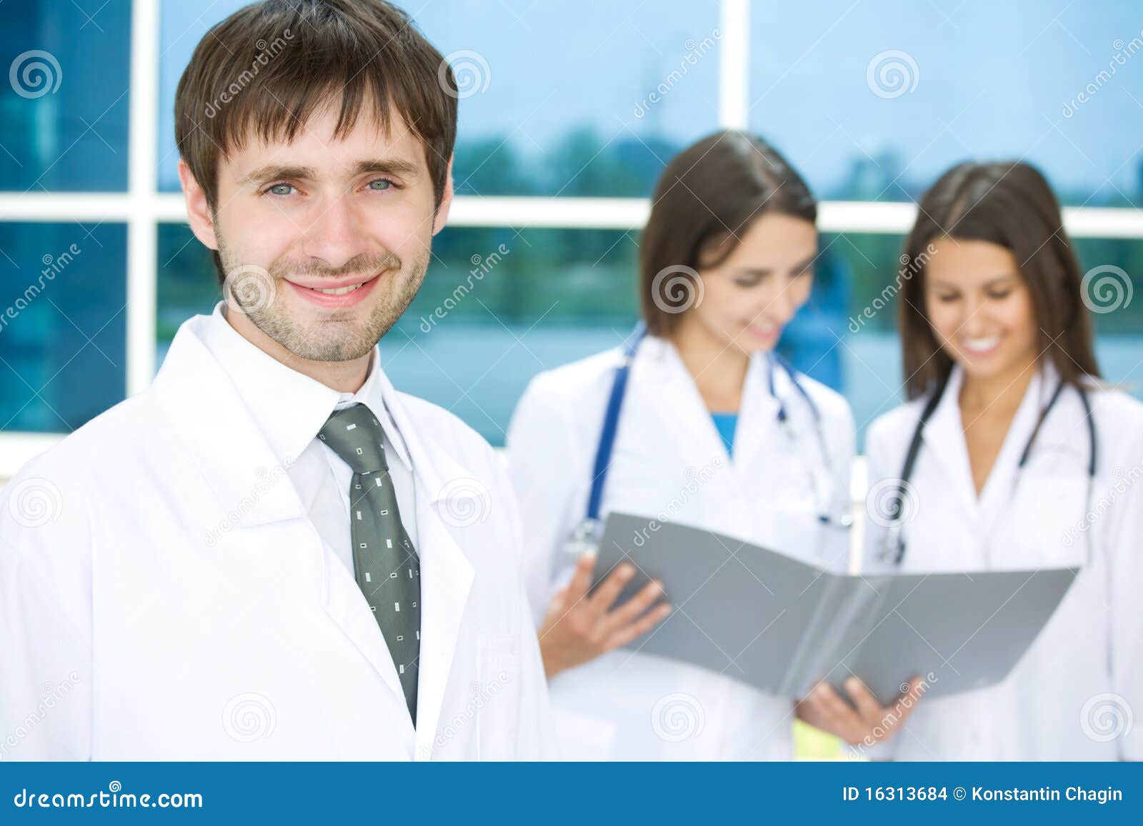 Doctor with two nurses stock photo. Image of females - 16313684