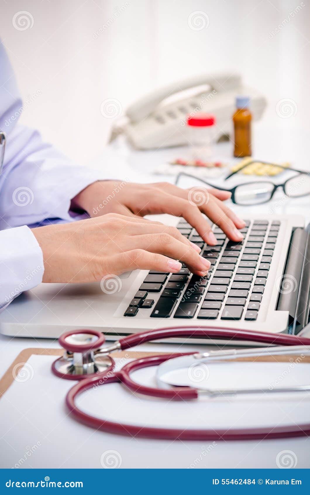 Doctor typing on computer stock photo. Image of doctor - 55462484