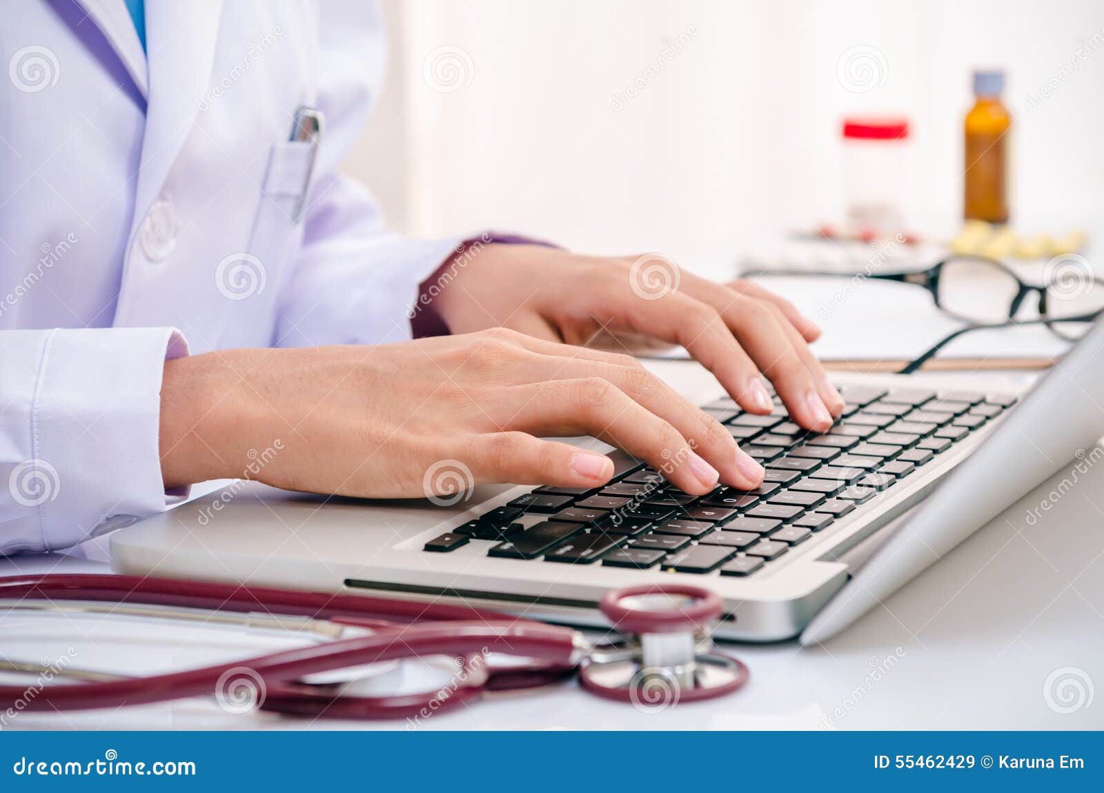 Doctor typing on computer stock image. Image of business - 55462429