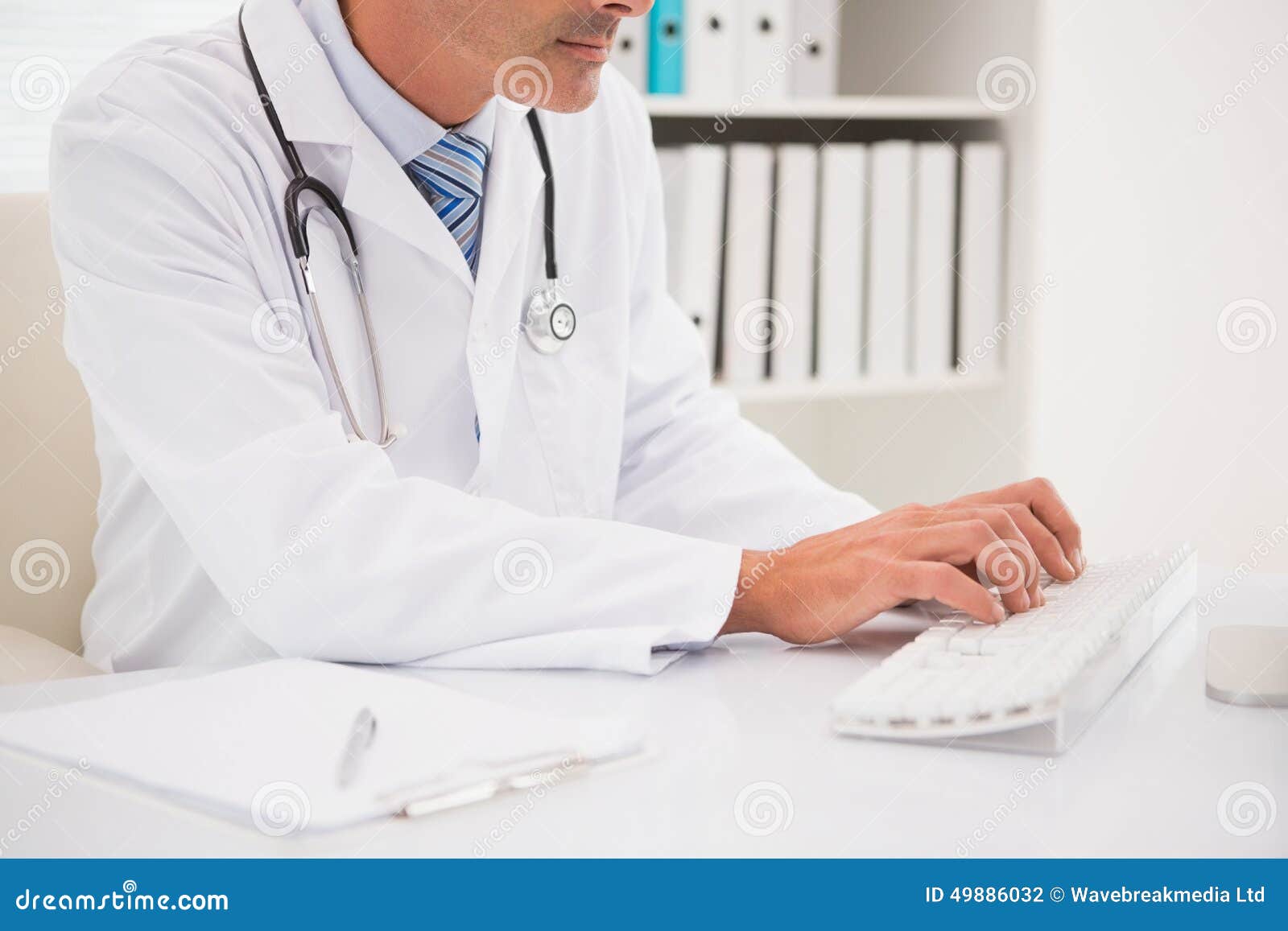 Doctor Typing on Keyboard and Stock Photo - Image of health, papers ...