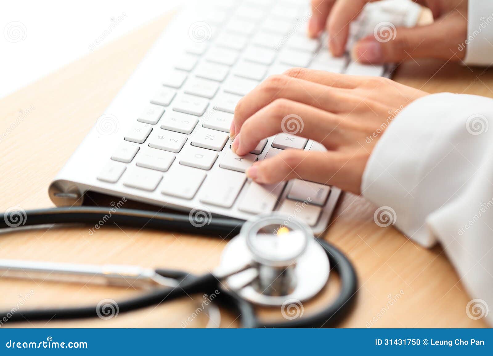 Doctor Typing in Keyboard with Stethoscope Stock Photo - Image of exam ...
