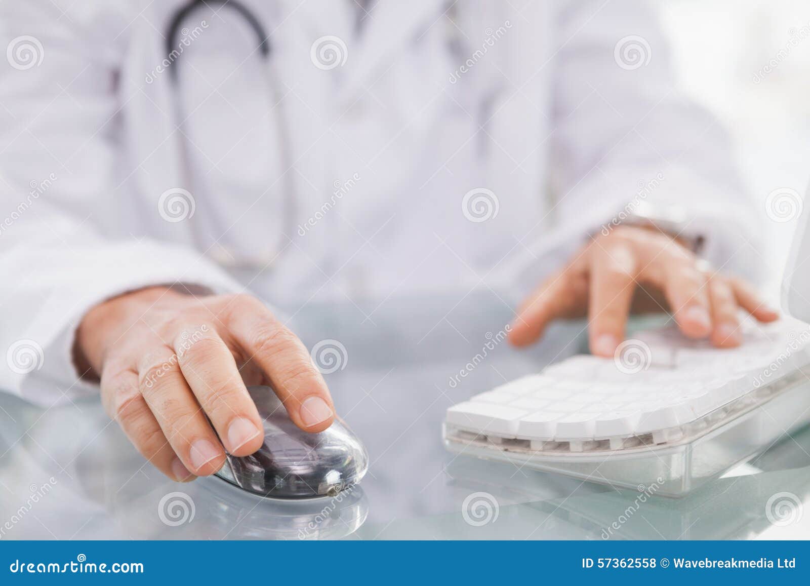 Doctor Typing on Keyboard and Using Mouse Stock Photo - Image of focus ...
