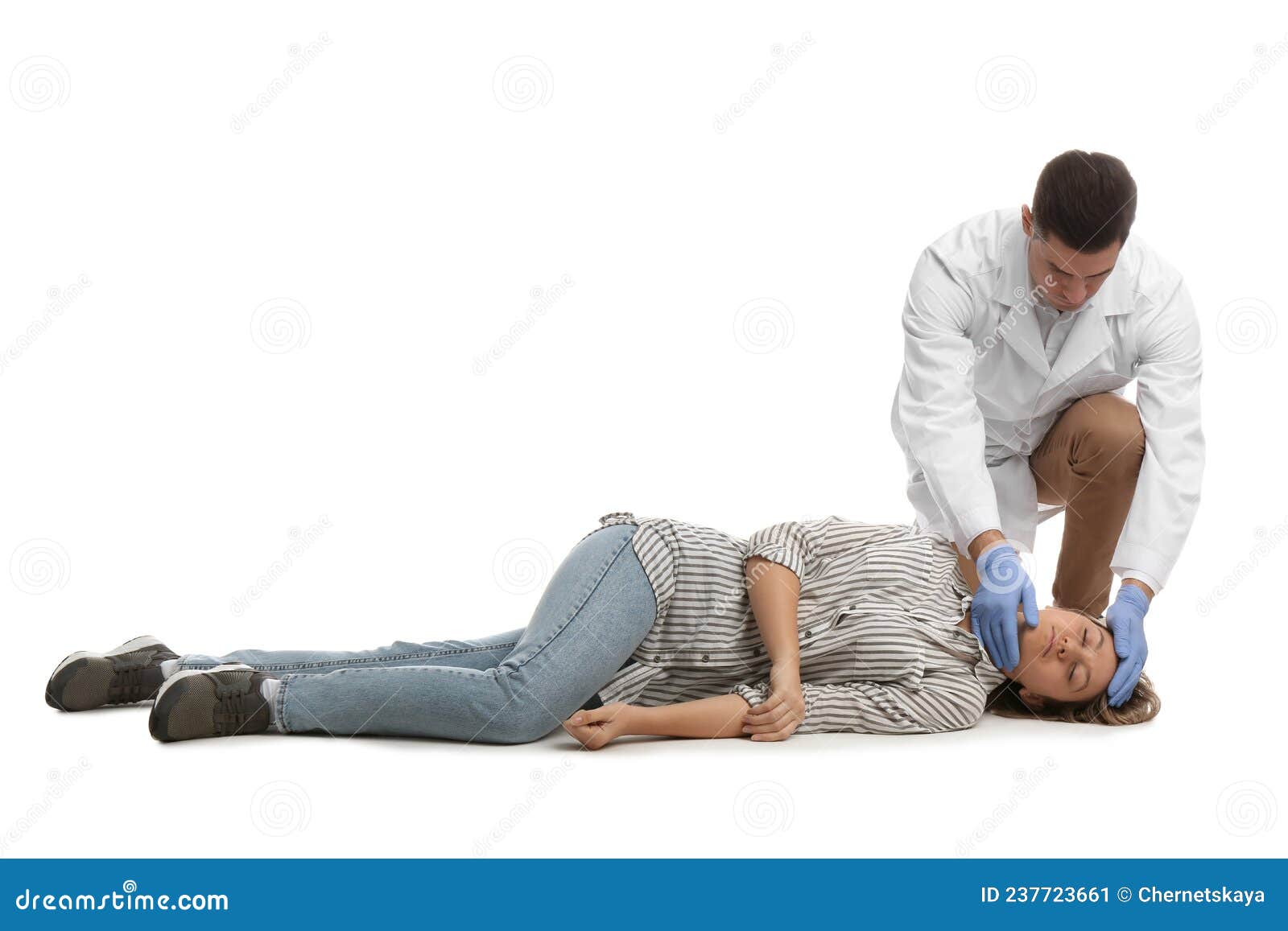 Doctor in Uniform Practicing First Aid on Woman Against White ...