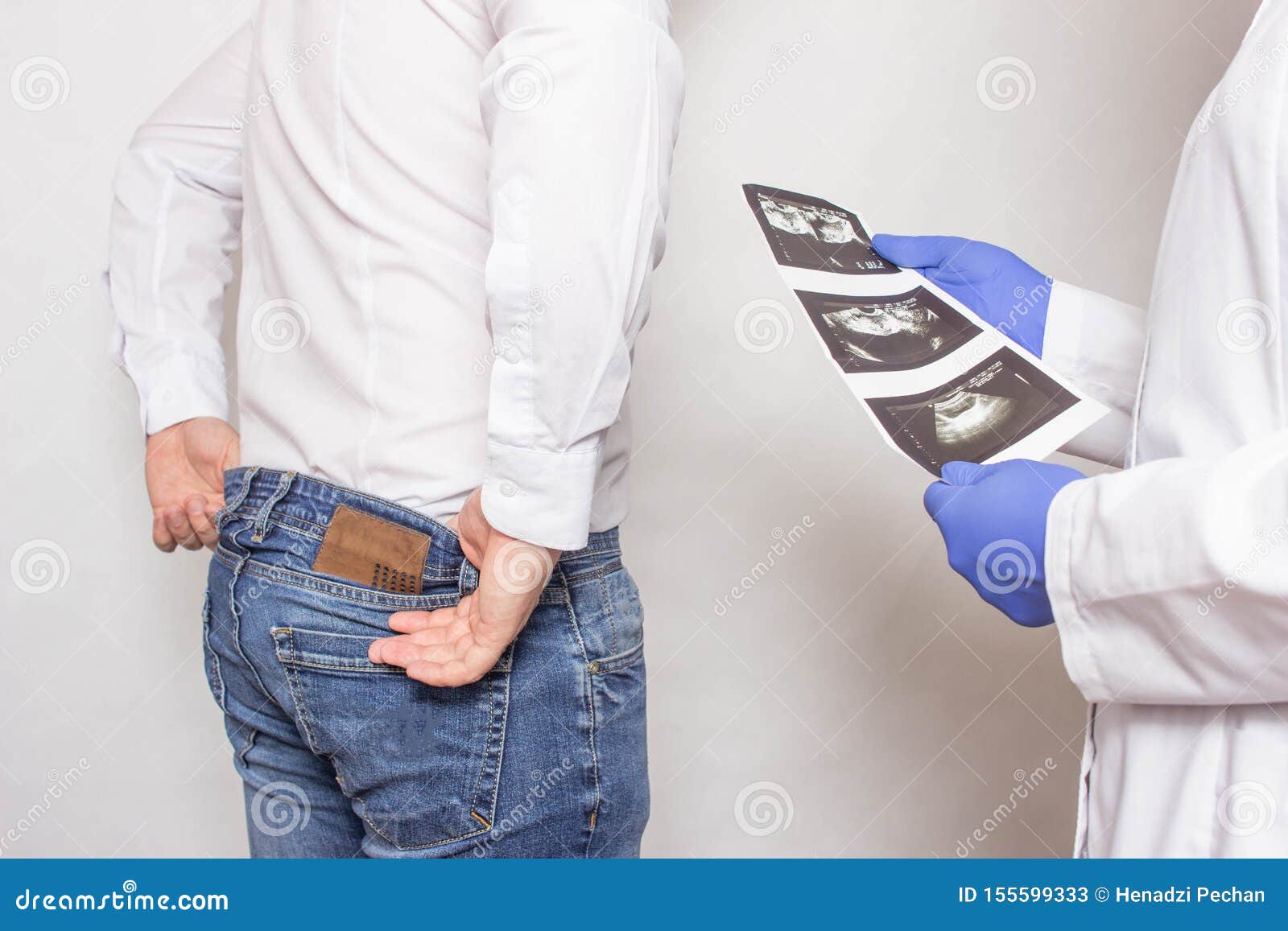 Doctor Urologist Holds A Picture Of An Ultrasound Examination Of The