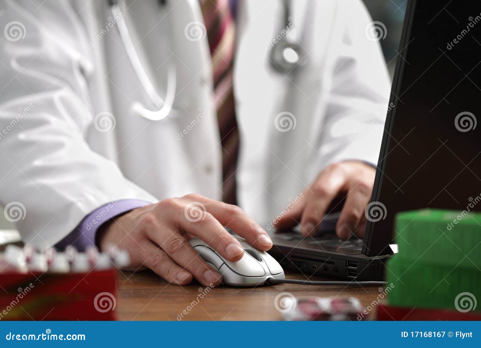 Doctor using computer stock image. Image of professional - 17168167