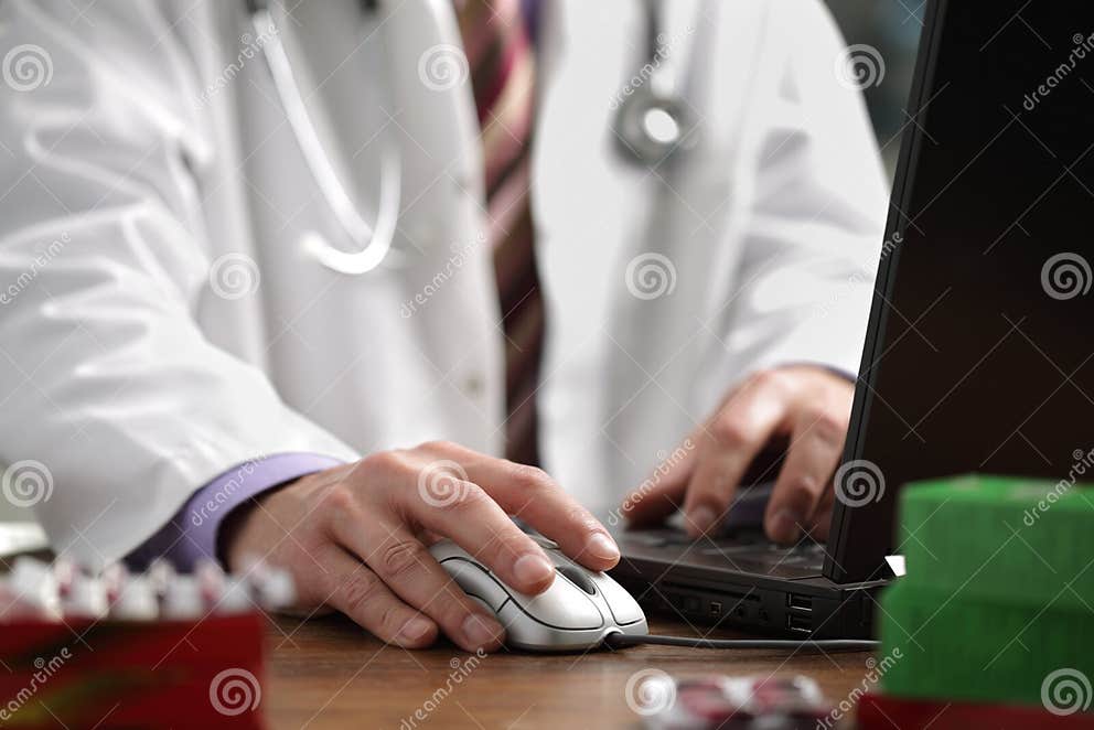 Doctor using computer stock image. Image of professional - 17168167