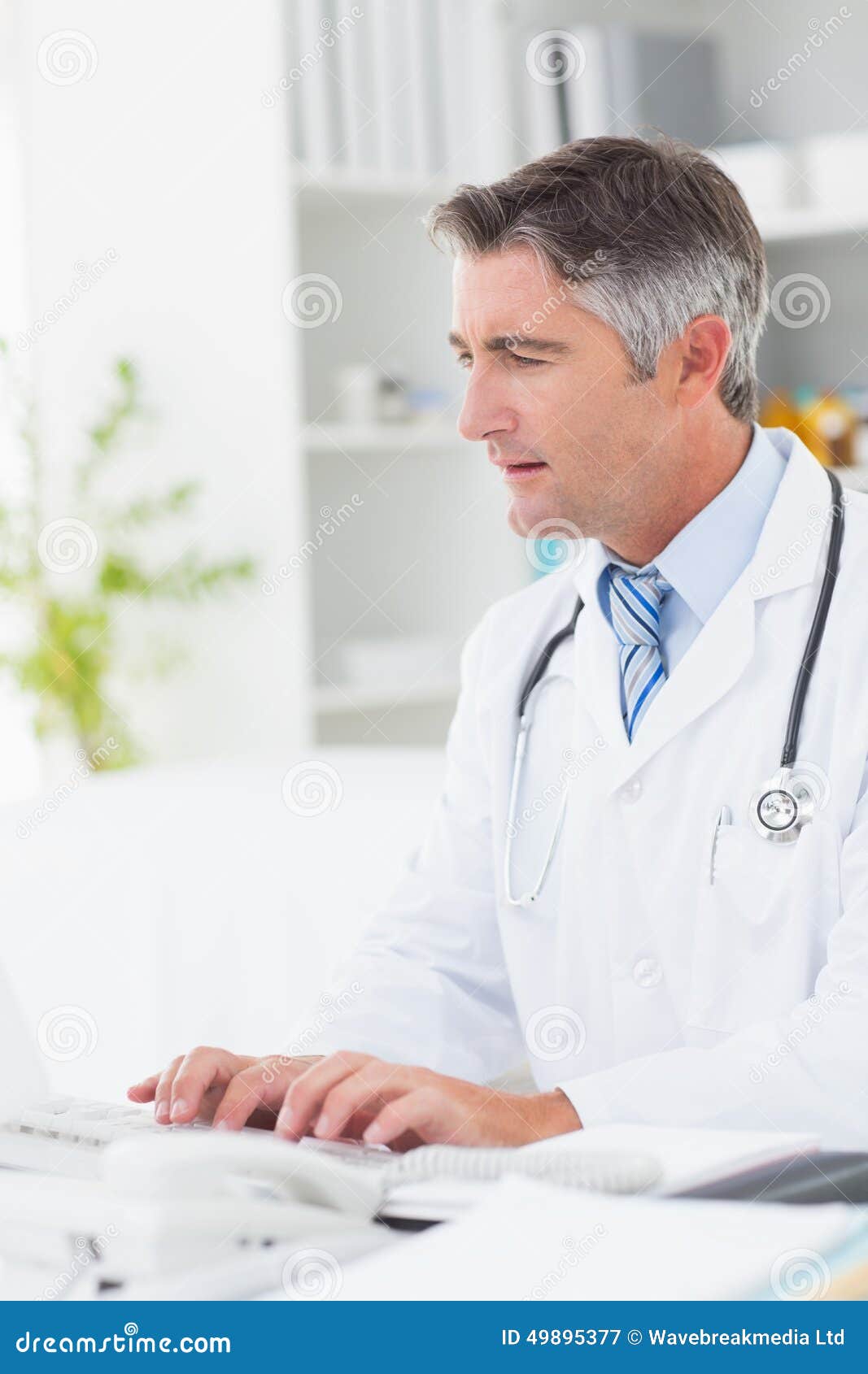 Doctor Using Computer Keyboard at Table Stock Image - Image of ...