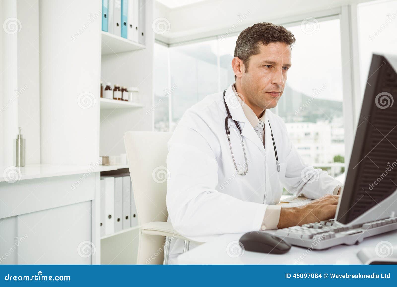 Doctor Using Computer at Medical Office Stock Photo - Image of ...
