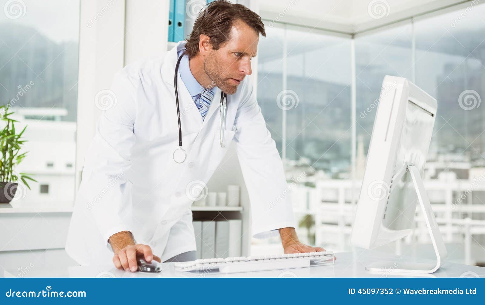 Doctor Using Computer at Medical Office Stock Photo - Image of indoors ...
