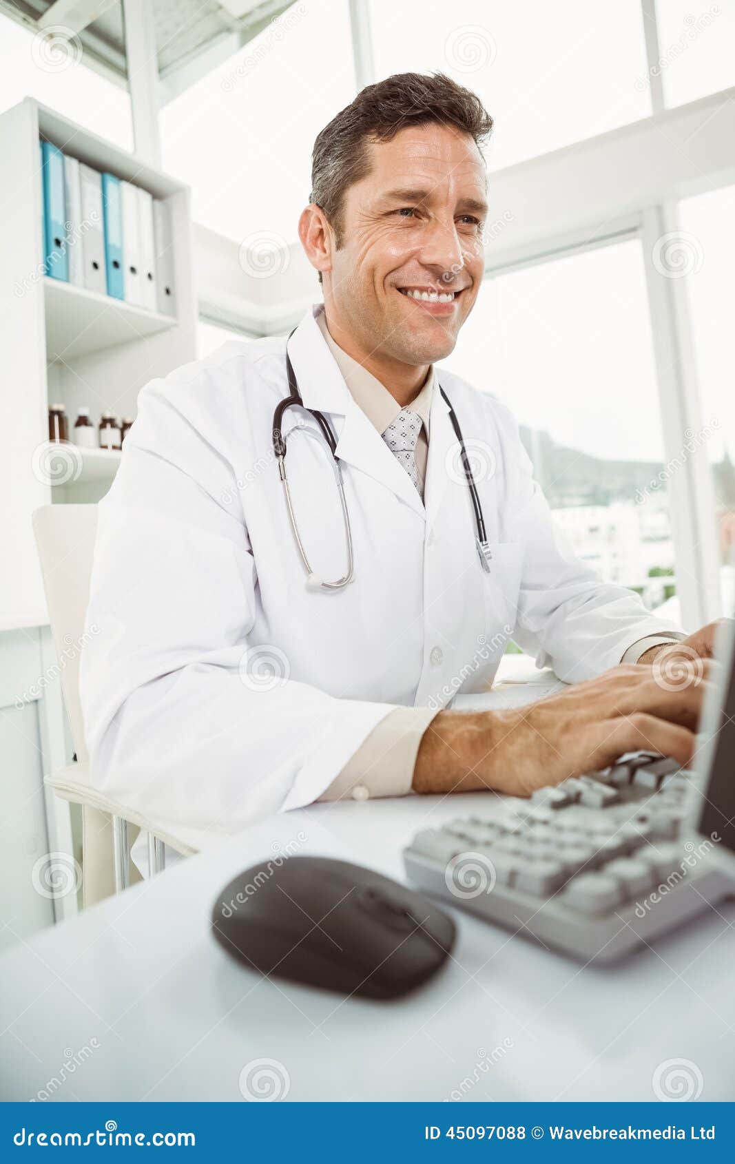Doctor Using Computer at Medical Office Stock Photo - Image of office ... Doctor Using Computer at Medical Office Stock Photo - Image of office ...