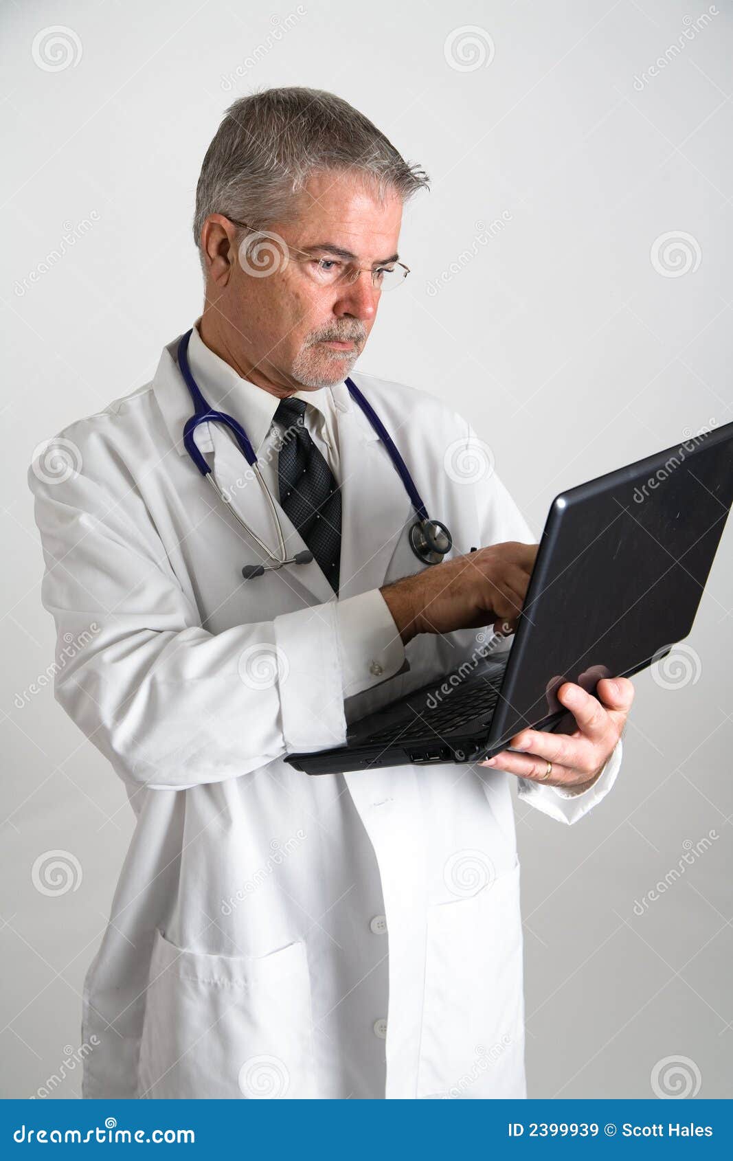 Doctor Using Computer Vertical Stock Image - Image of worried, male ...
