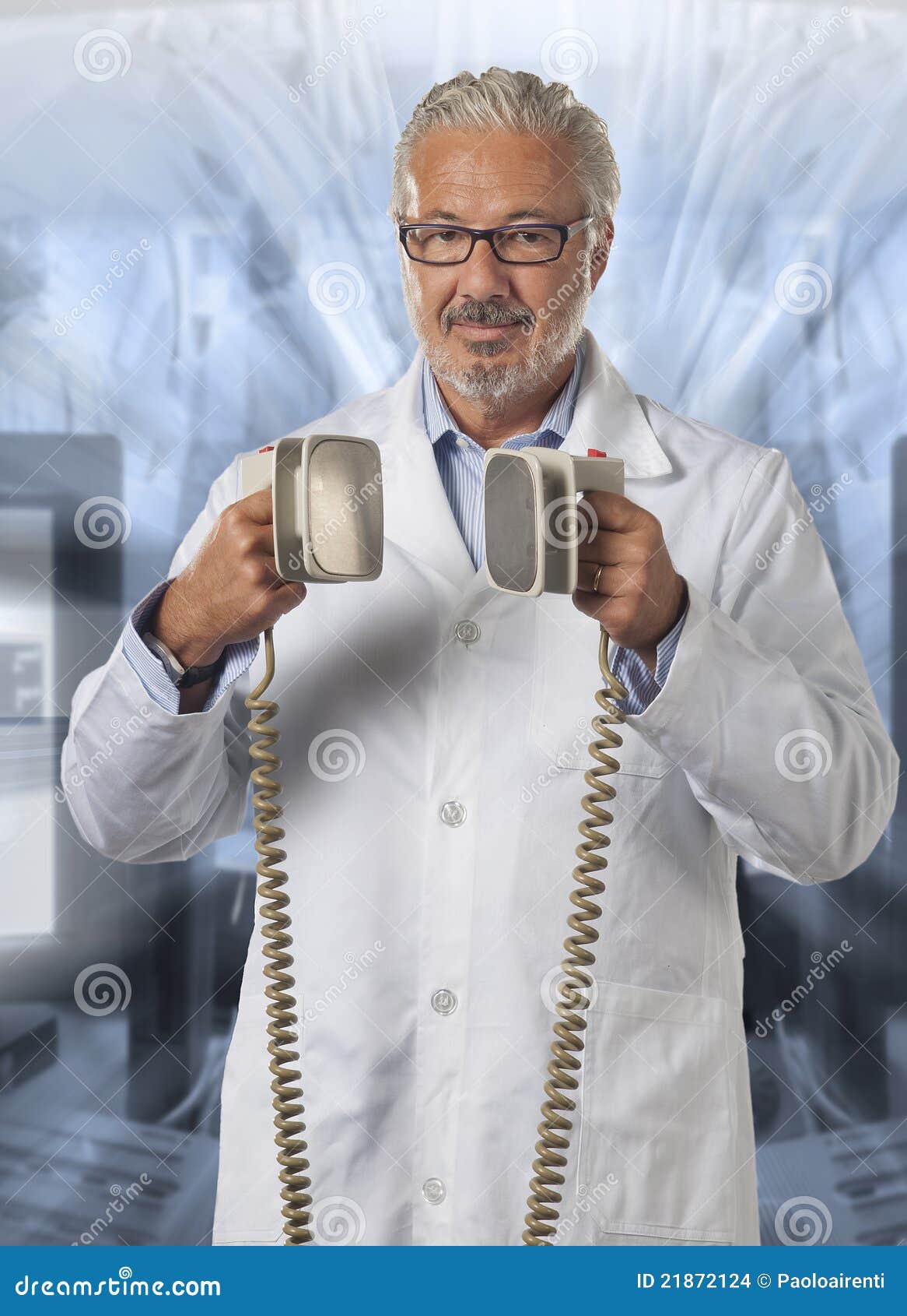 Doctor Using a Defibrillator Stock Photo - Image of doctor, healthcare ...