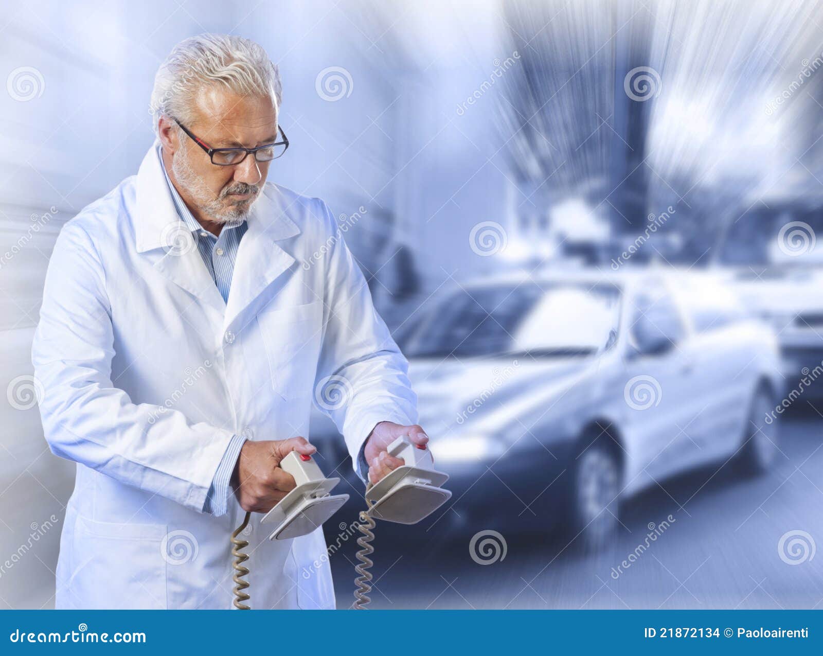 Doctor Using a Defibrillator Stock Photo - Image of defibrillator ...