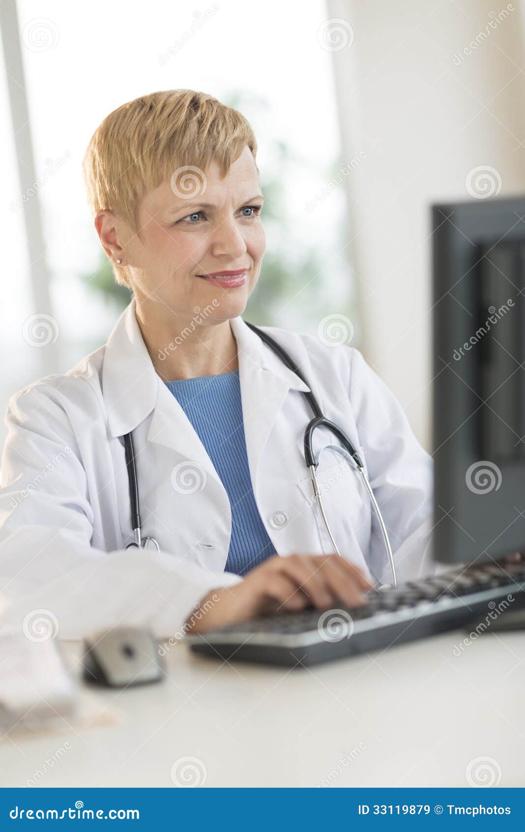 Doctor Using Desktop PC in Clinic Stock Image - Image of desk ...