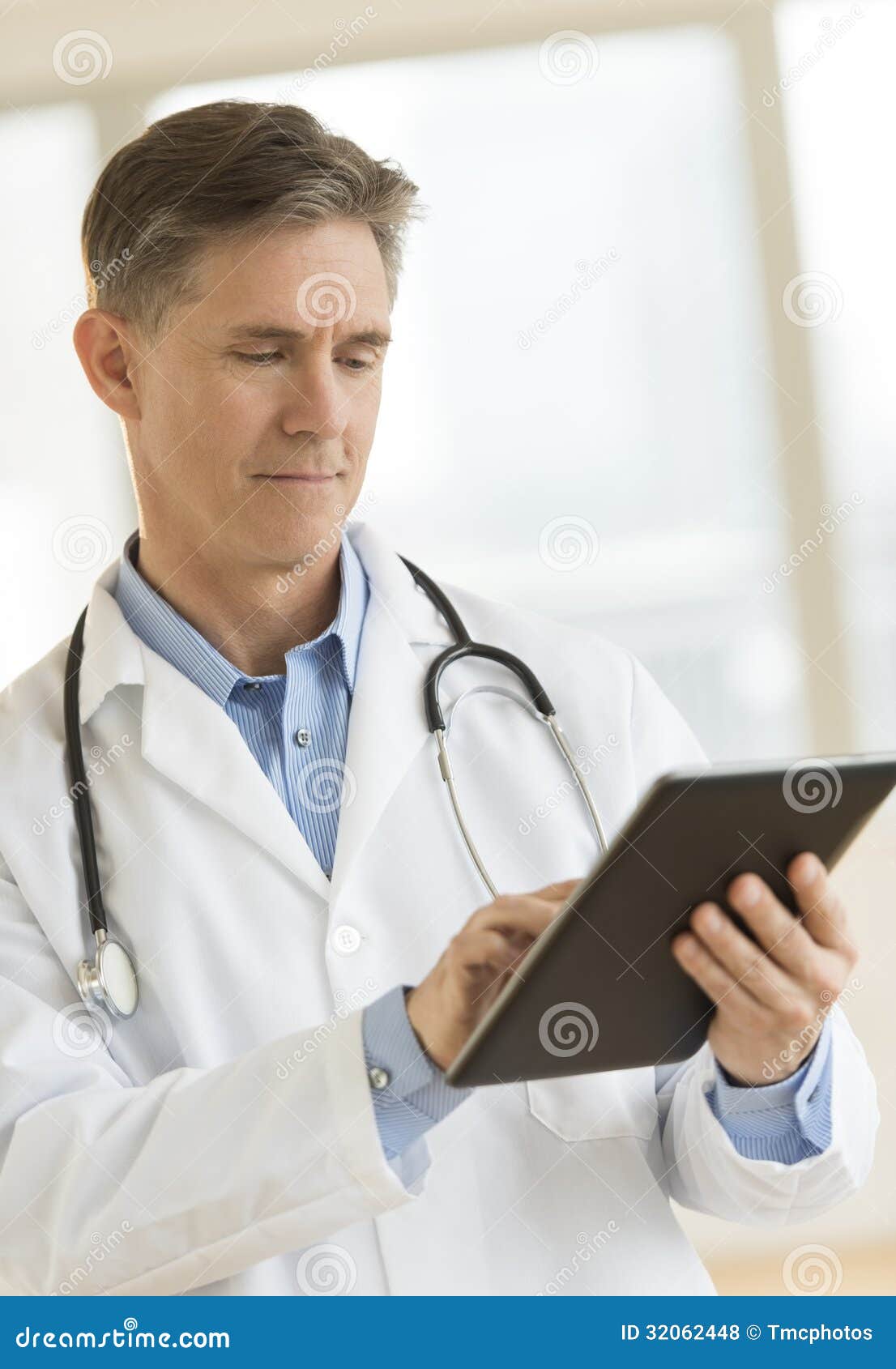 Doctor Using Digital Tablet in Clinic Stock Photo - Image of ...