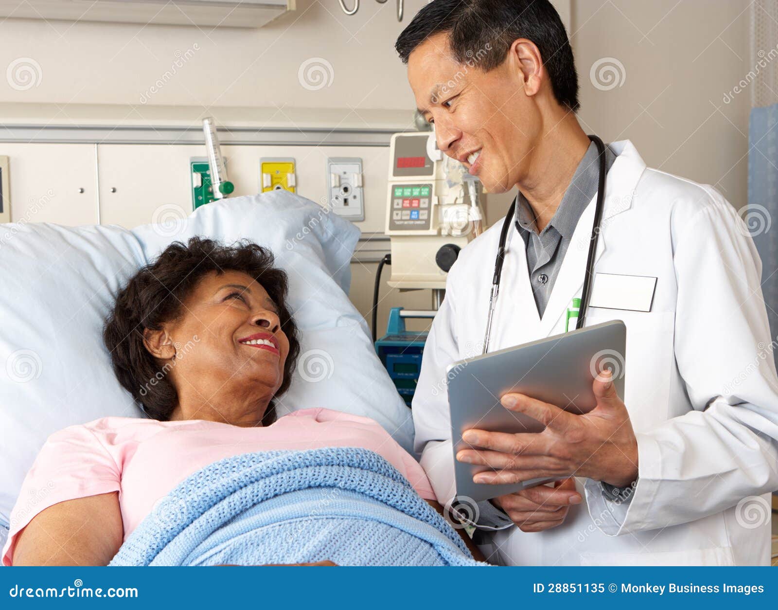 Doctor Using Digital Tablet Talking with Senior Patient Stock Image ...