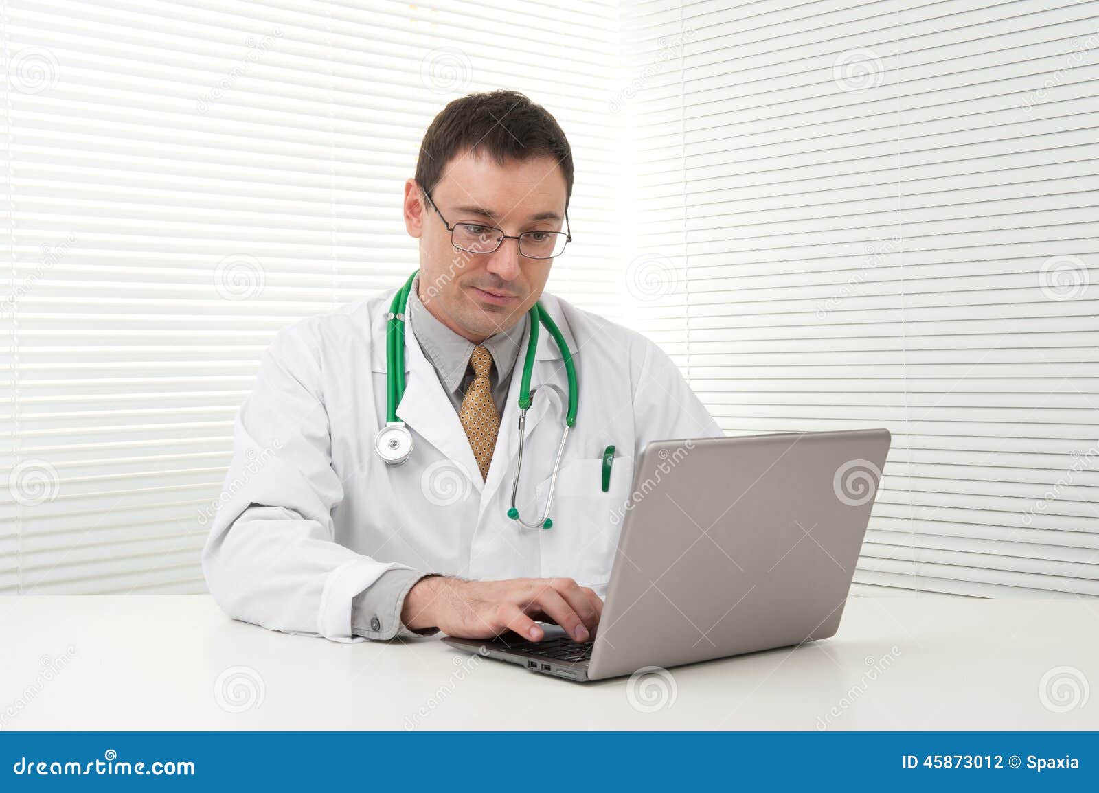 Doctor Using His Laptop Computer Stock Photo - Image of notebook ...