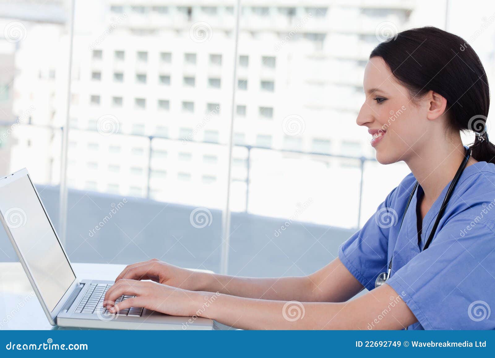 Doctor using a laptop stock image. Image of hand, indoors - 22692749