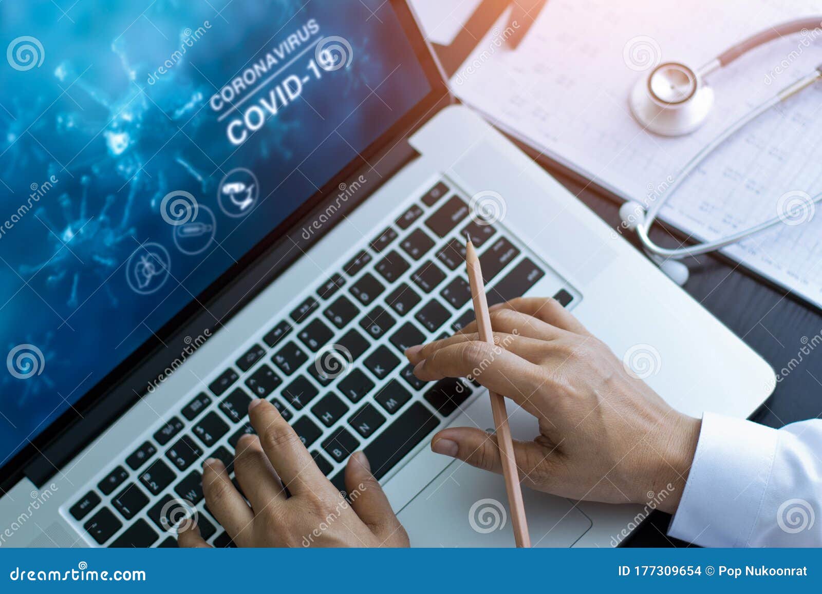 Doctor Using Laptop Computer and Analysis Coronavirus or Covid-19 Data ...