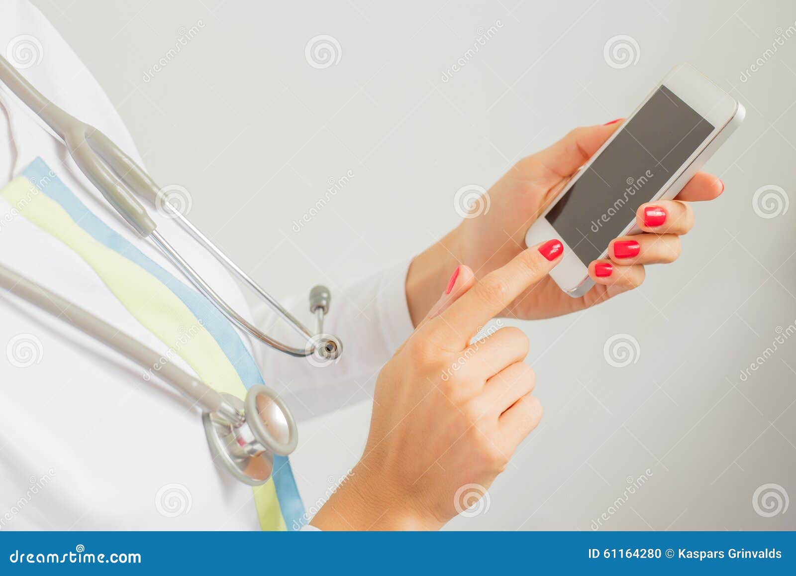 Doctor using mobile device stock photo. Image of phone - 61164280