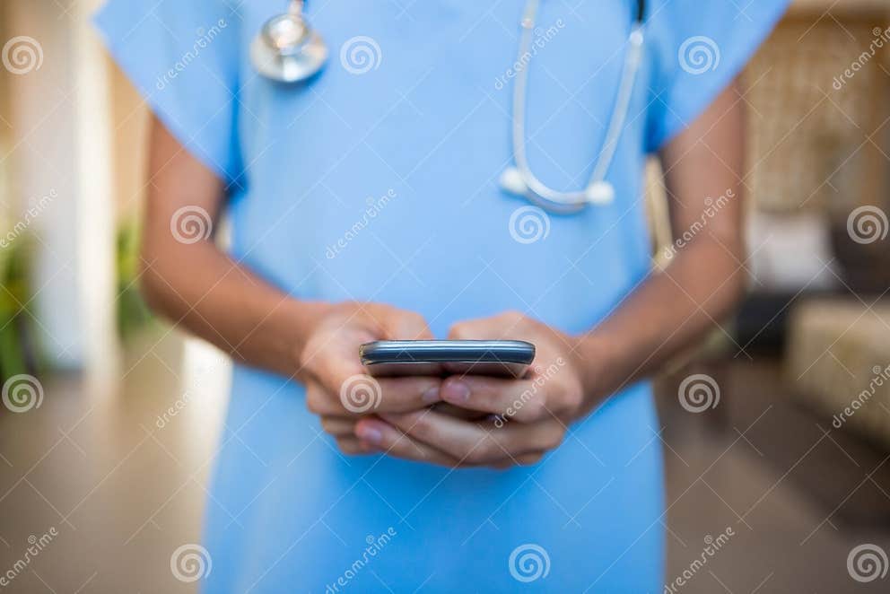 Doctor Using Mobile Phone in Hospital Stock Photo - Image of ...