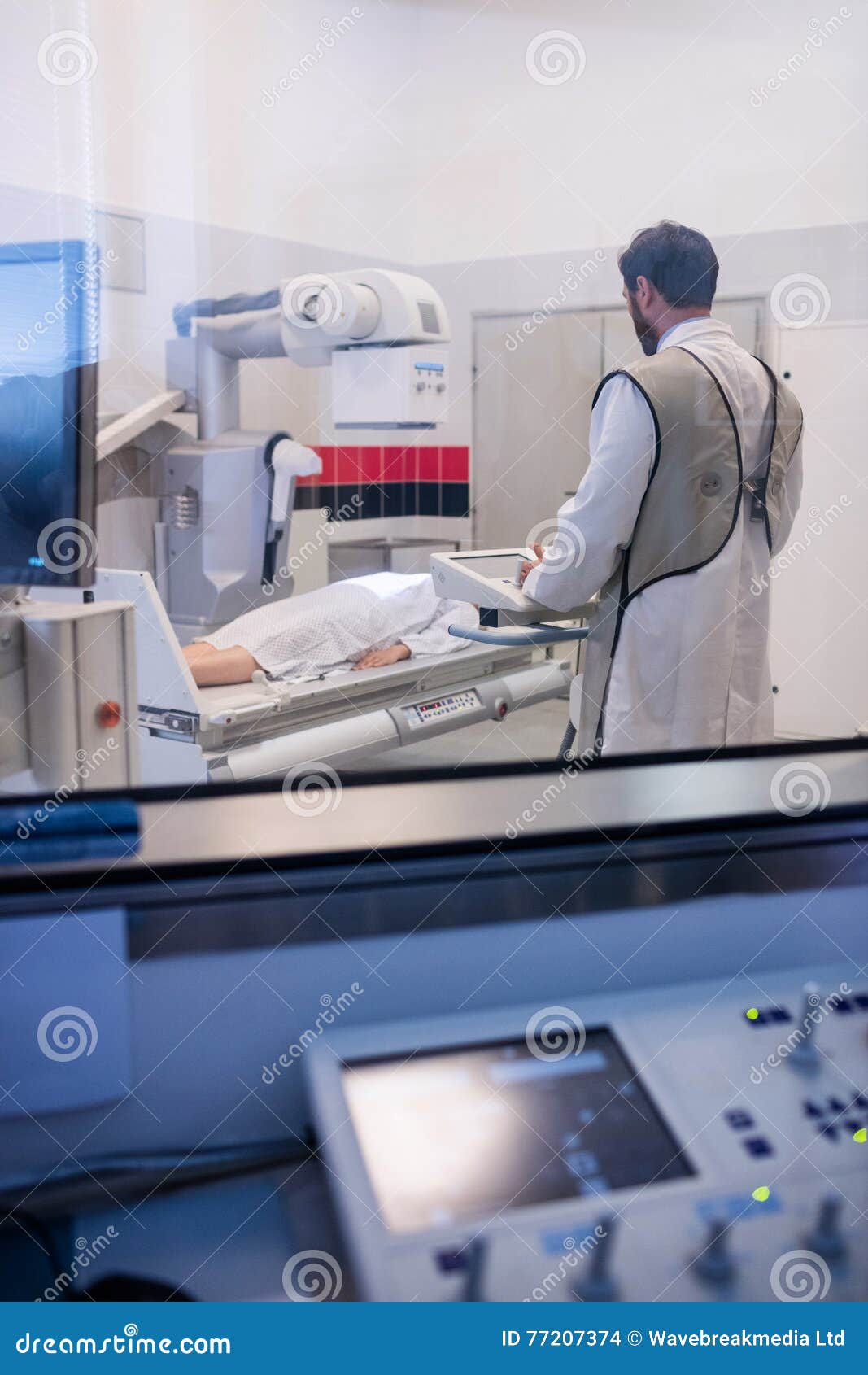 Doctor Using X-ray Machine To Examine Patient Stock Photo - Image of ...