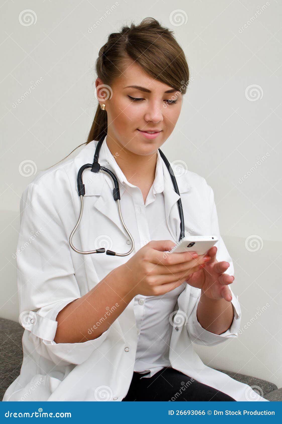Doctor using smartphone stock photo. Image of indoors - 26693066