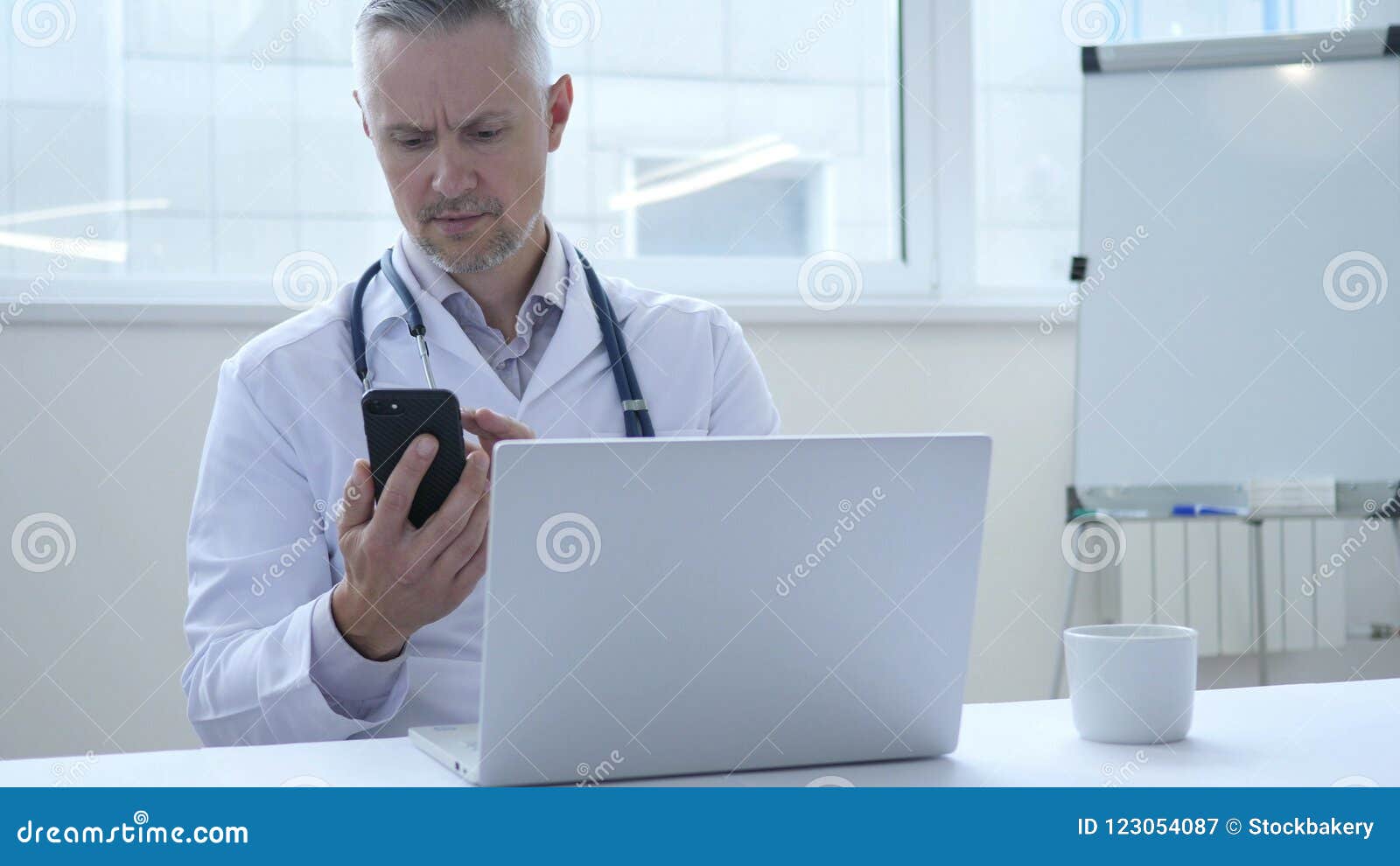 Doctor Using Smartphone for Internet Stock Image - Image of hospital ...