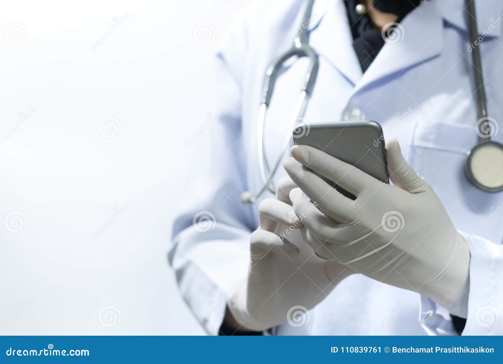 Doctor Using Smartphone with Patient in Hospital Interior Blur for ...