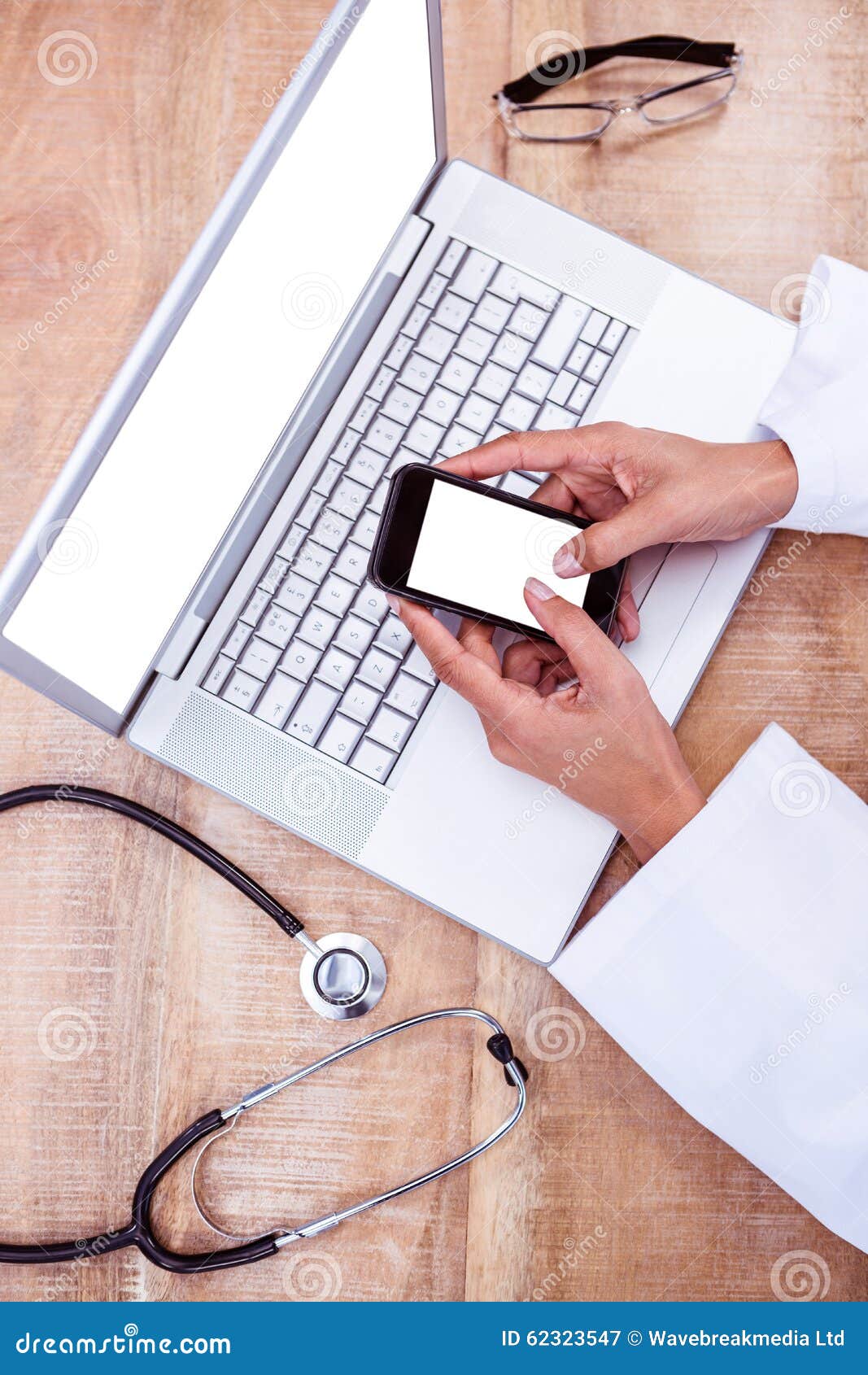 Doctor Using Smartphone on Wooden Desk Stock Image - Image of check ...