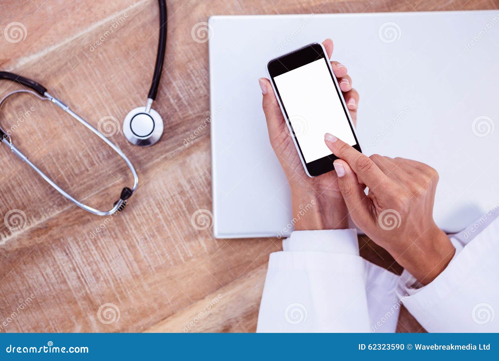 Doctor Using Smartphone on Wooden Desk Stock Photo - Image of phone ...