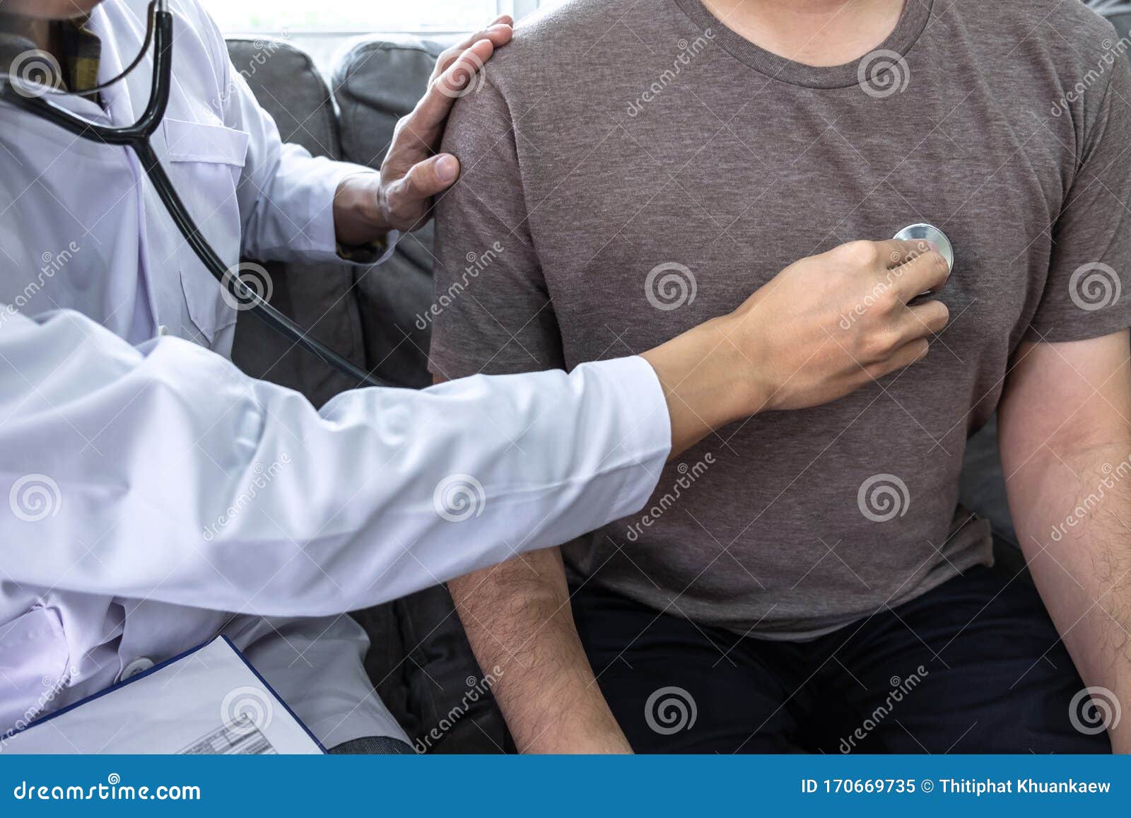 Doctor Using a Stethoscope Checking Patient about the Problem of ...