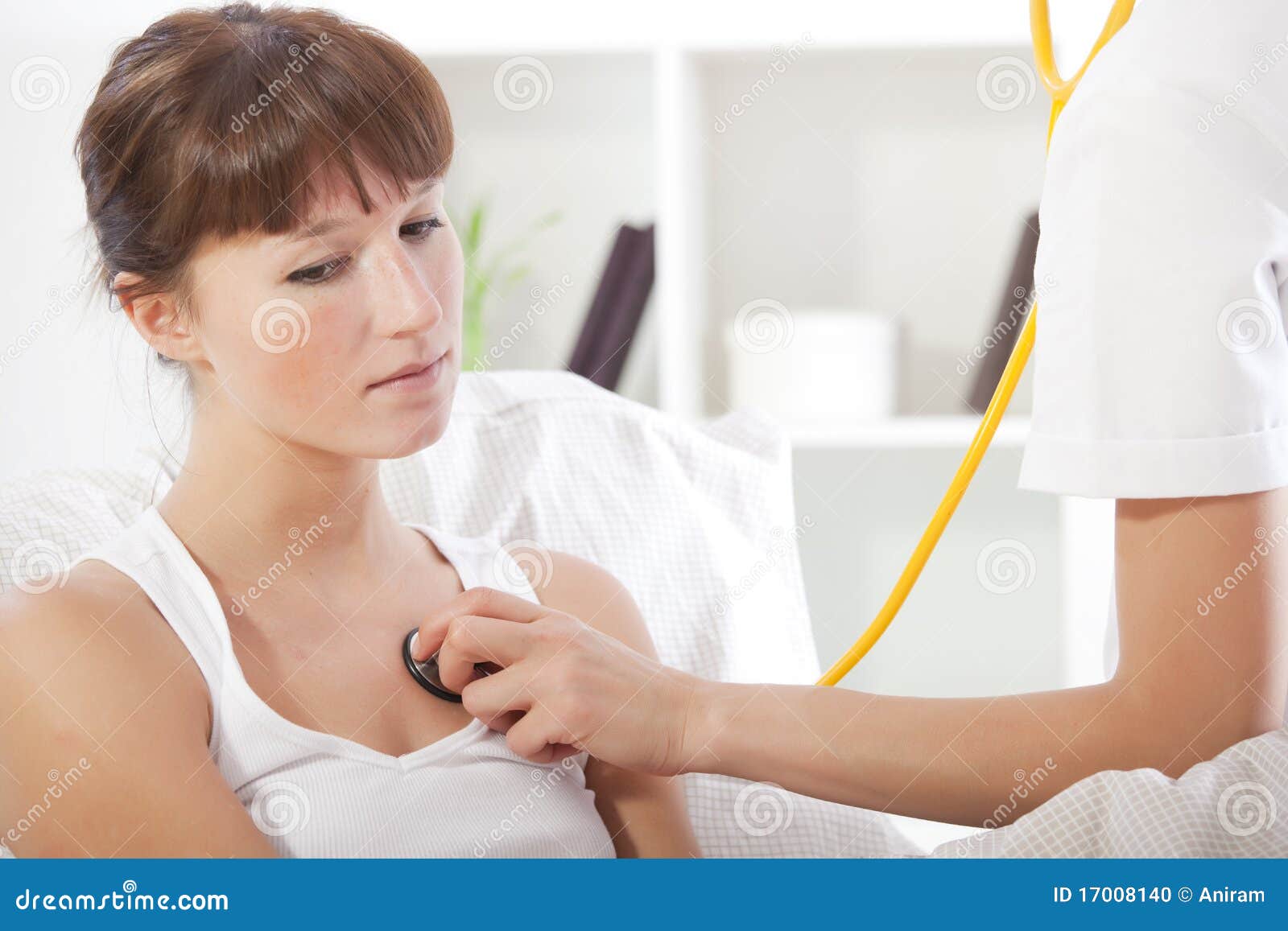 Doctor Using Stethoscope on Patient Stock Photo - Image of woman ...