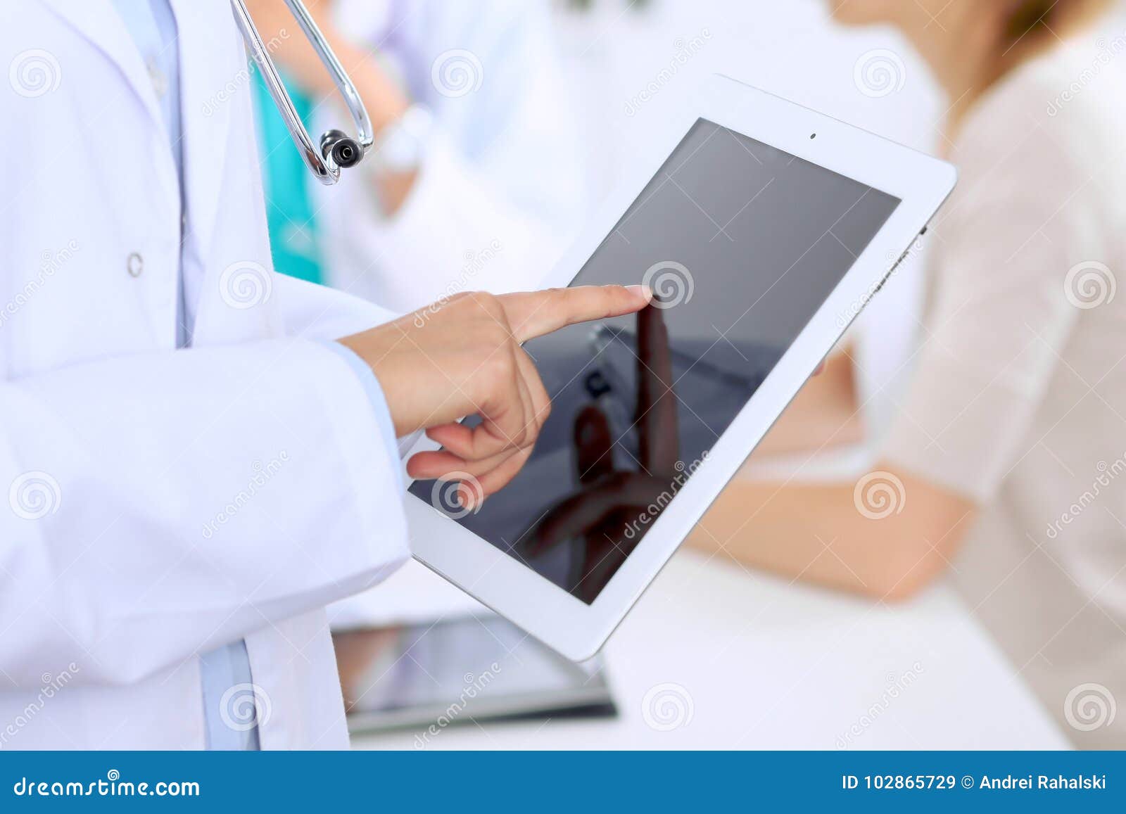 Doctor Using Tablet Computer, Close-up of Hands at Touch Pad Screen ...
