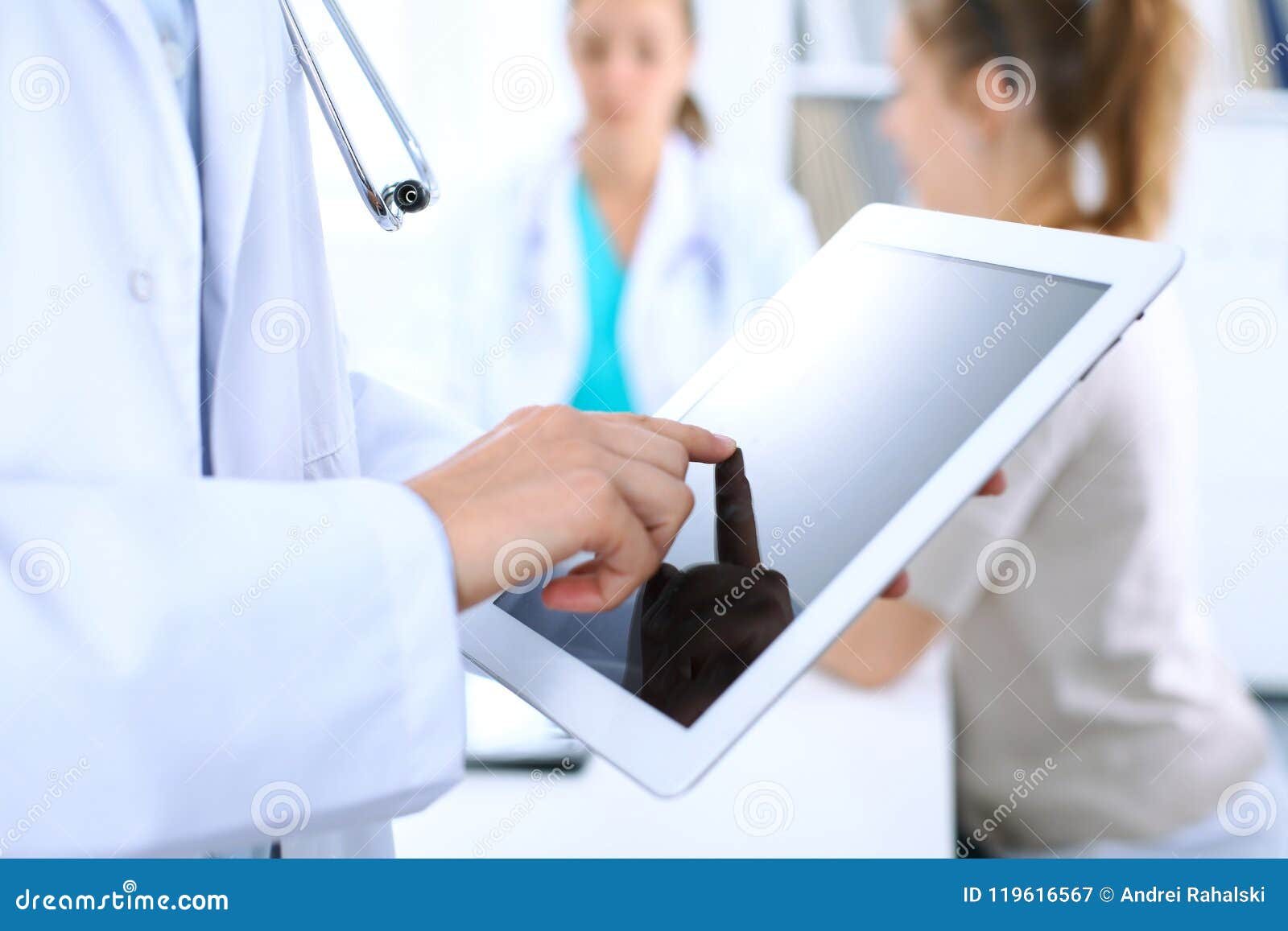 Doctor Using Tablet Computer, Close-up of Hands at Touch Pad Screen ...