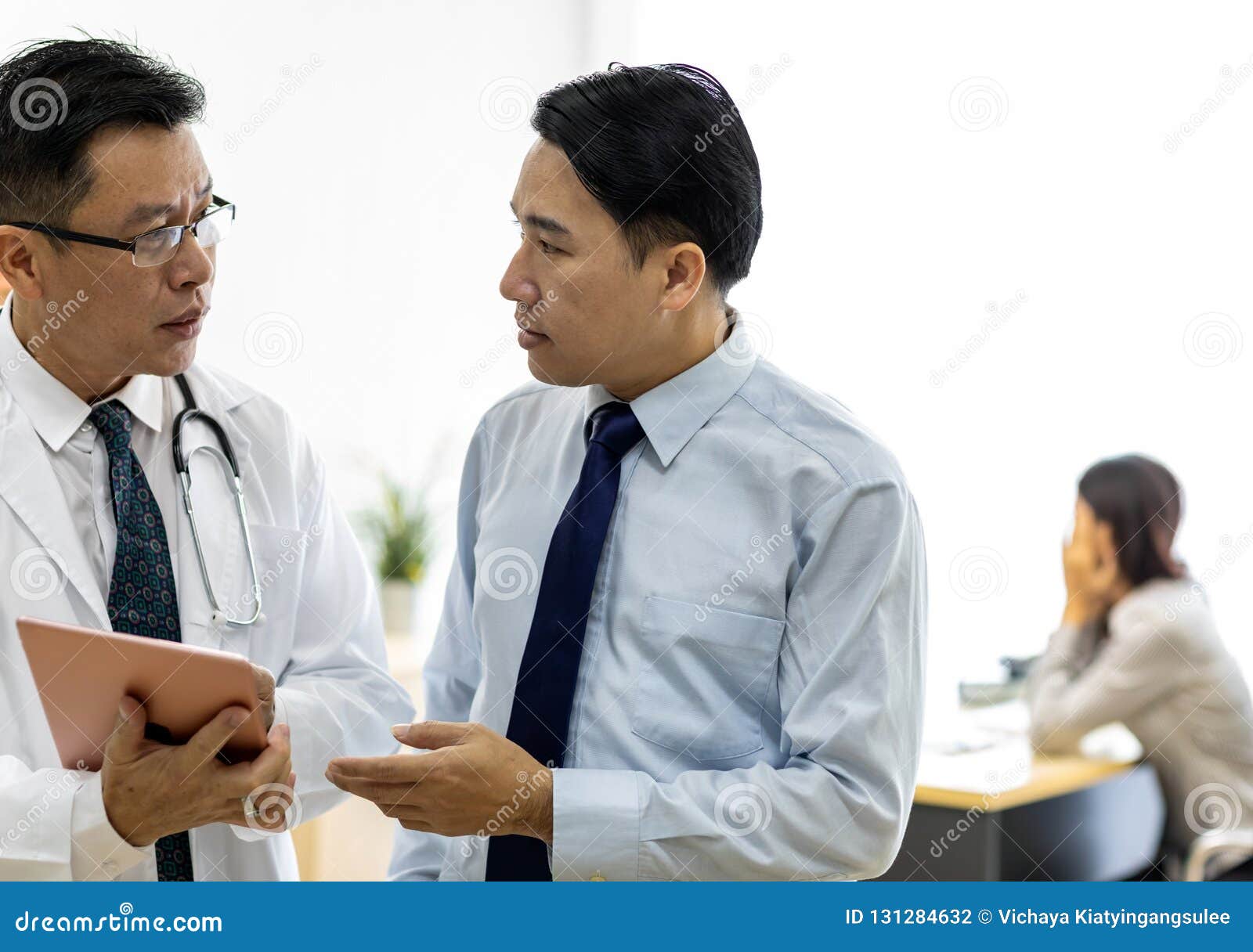Doctor using tablet stock photo. Image of communication - 131284632