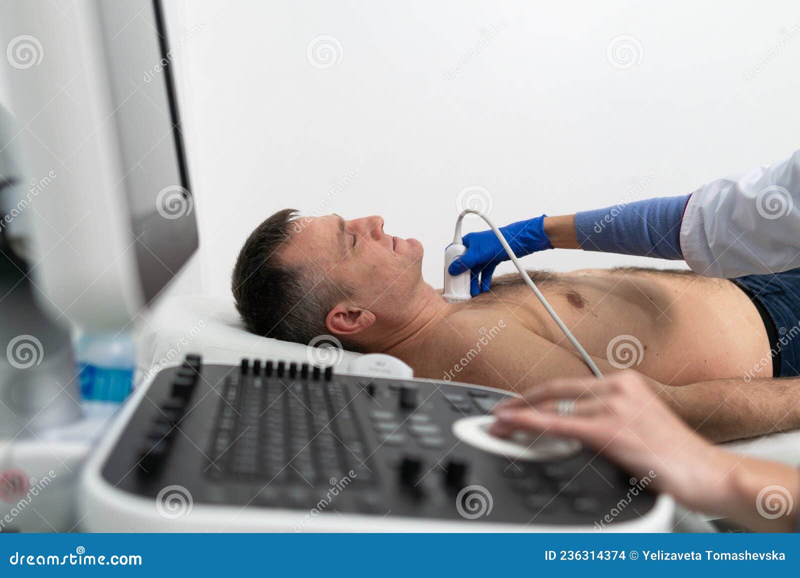 Doctor Using Ultrasound Machine To Scan Heart Of A Male Patient Cardiologist Makes A Patient An