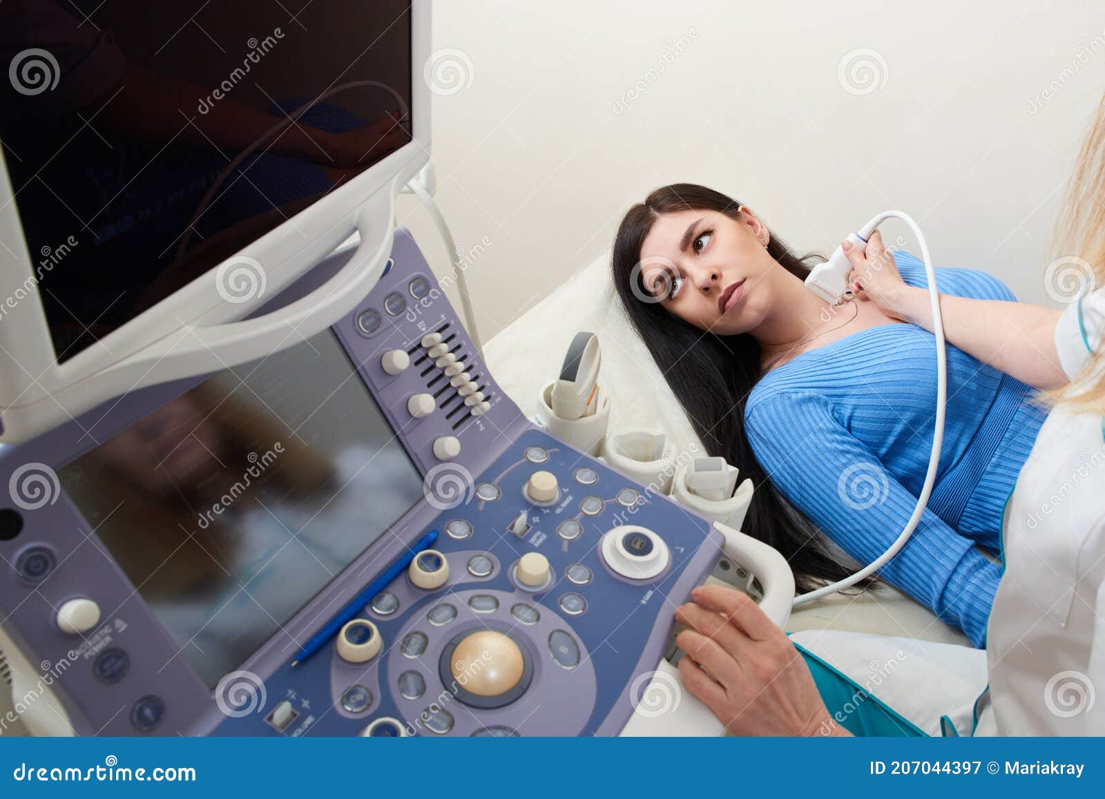 Doctor Using Ultrasound Scanning Machine Examining Female Neck Stock