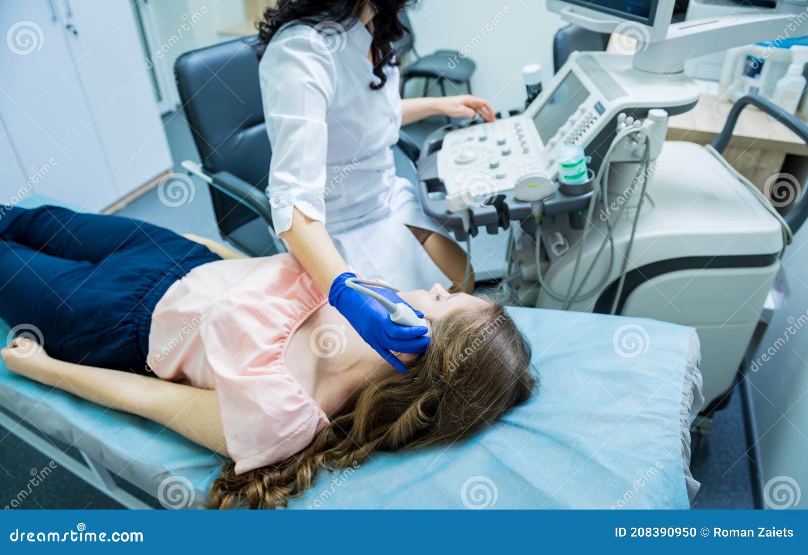 Doctor Using Ultrasound Scanning Machine For Examining A Head Of Woman